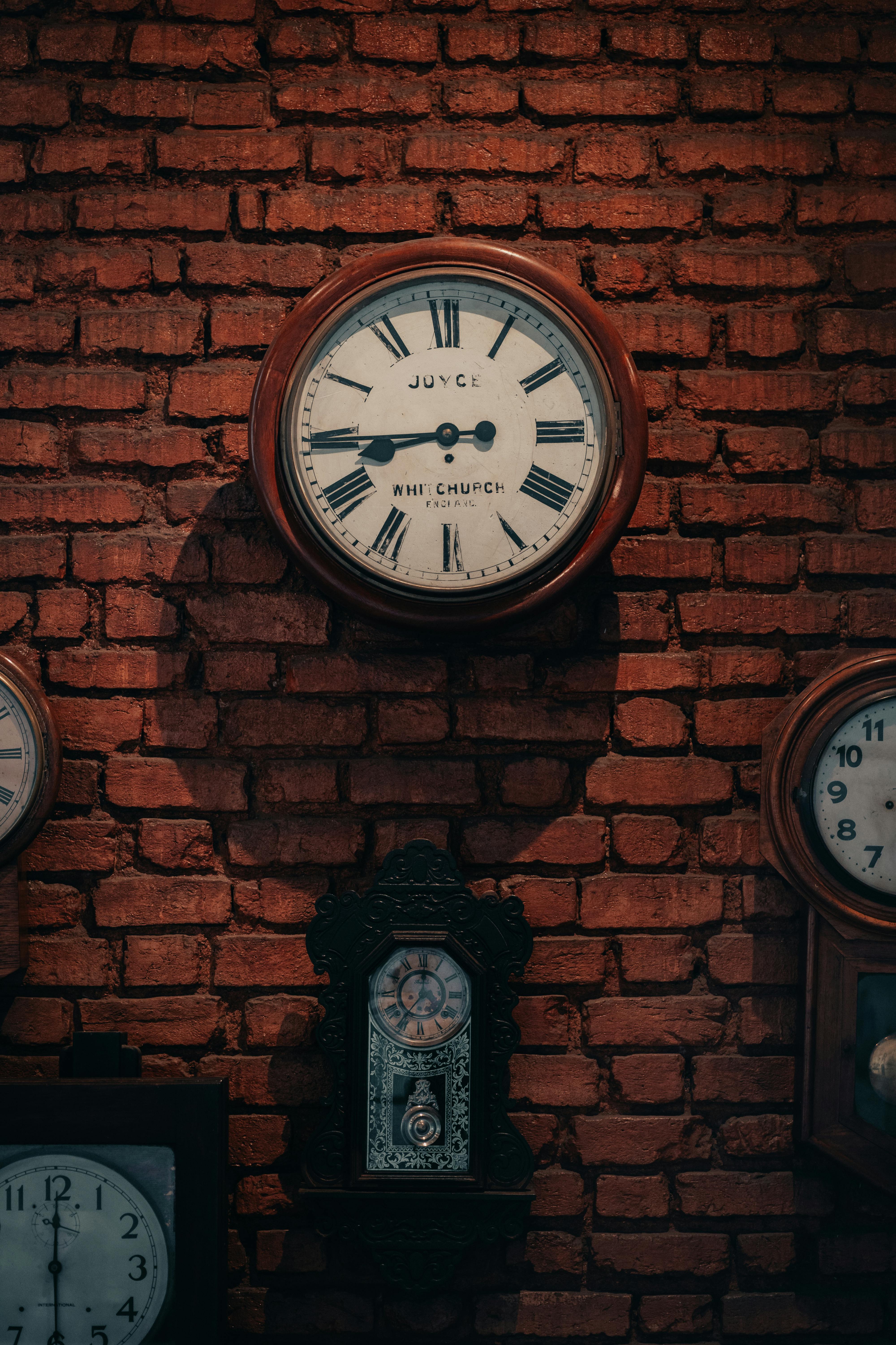 Collection of retro wall clocks in antique store · Free Stock Photo