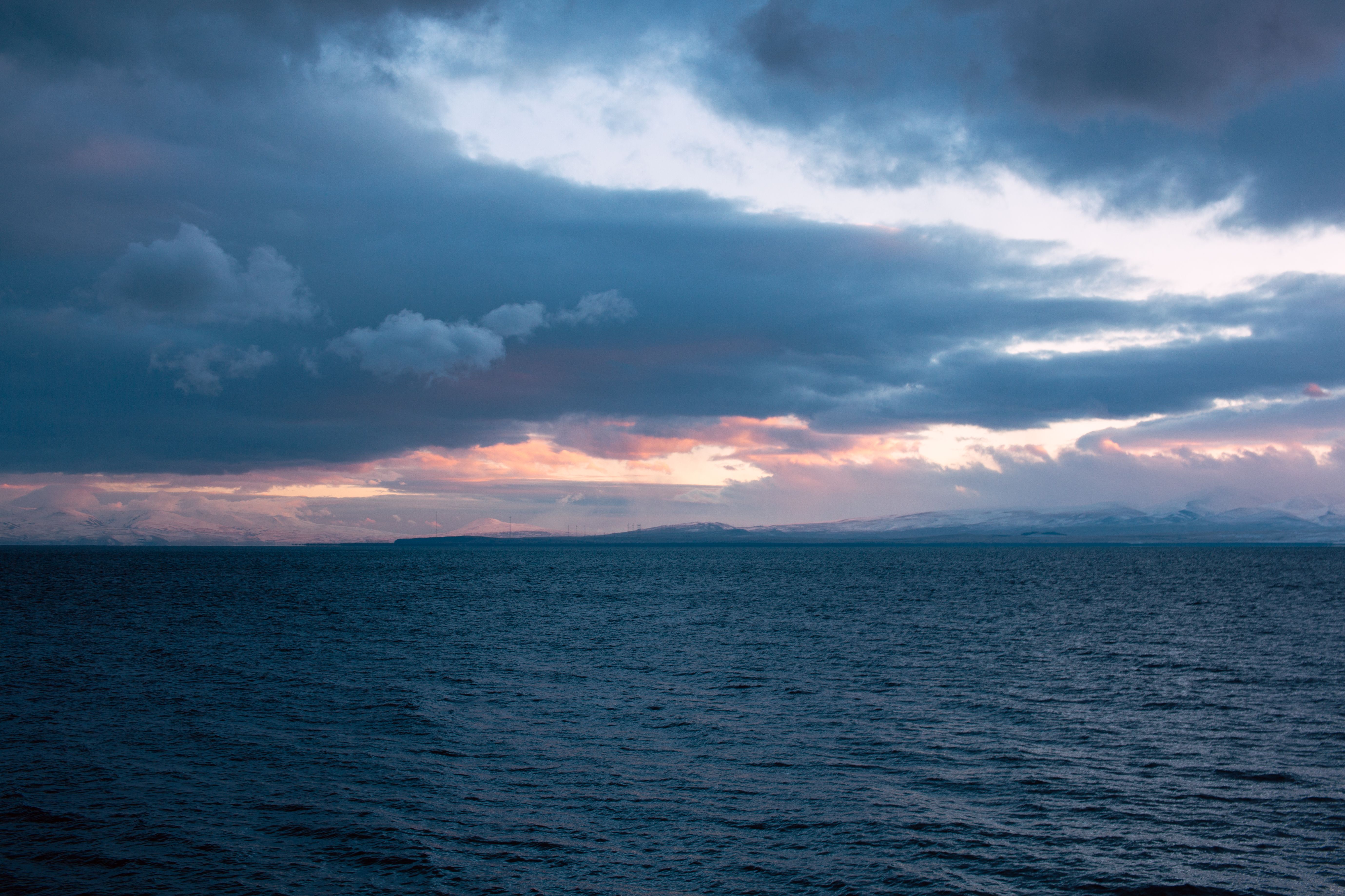 Body of Water Under Cloudy Sky · Free Stock Photo