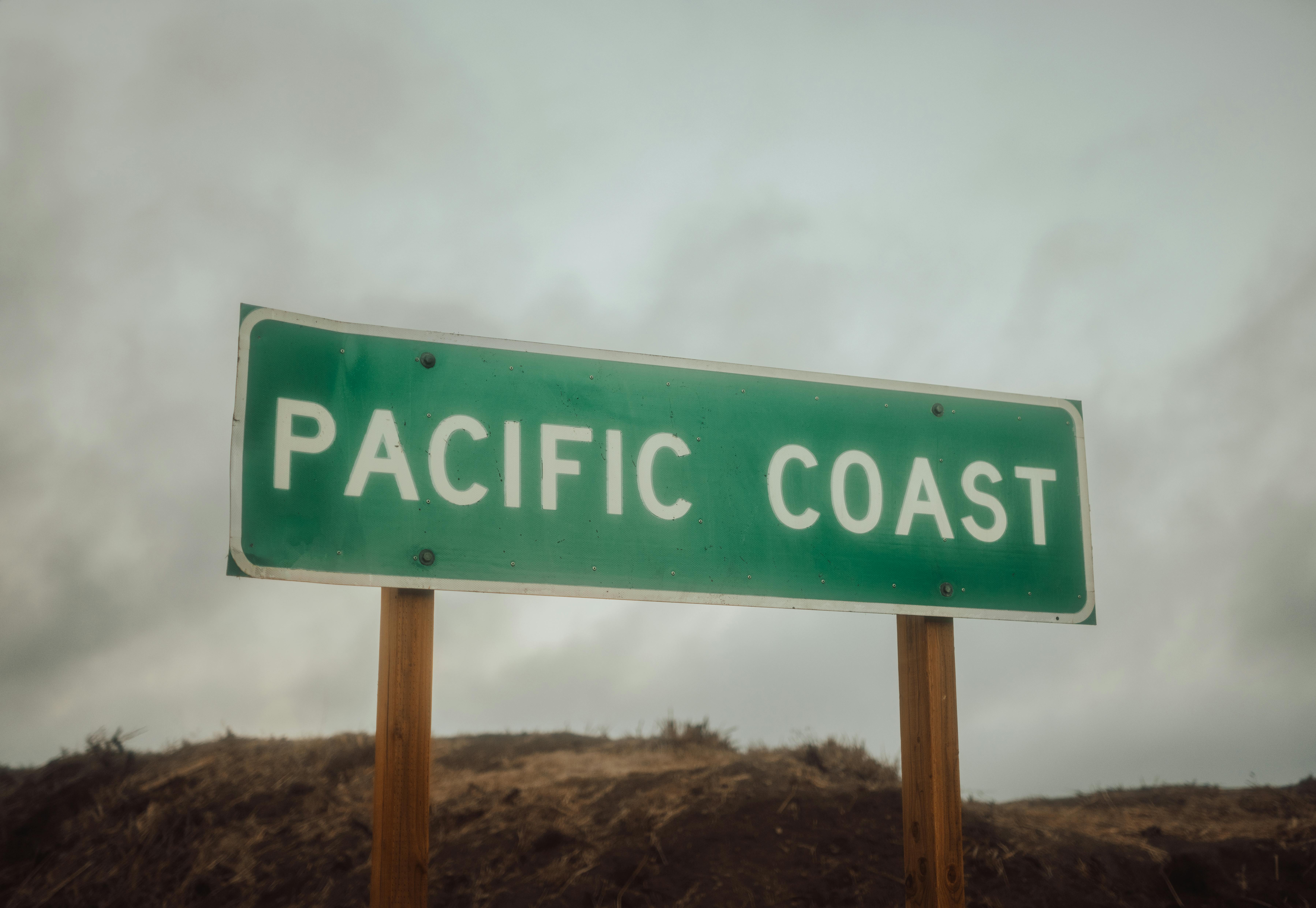 Clouds over Pacific Coast Road Sign · Free Stock Photo
