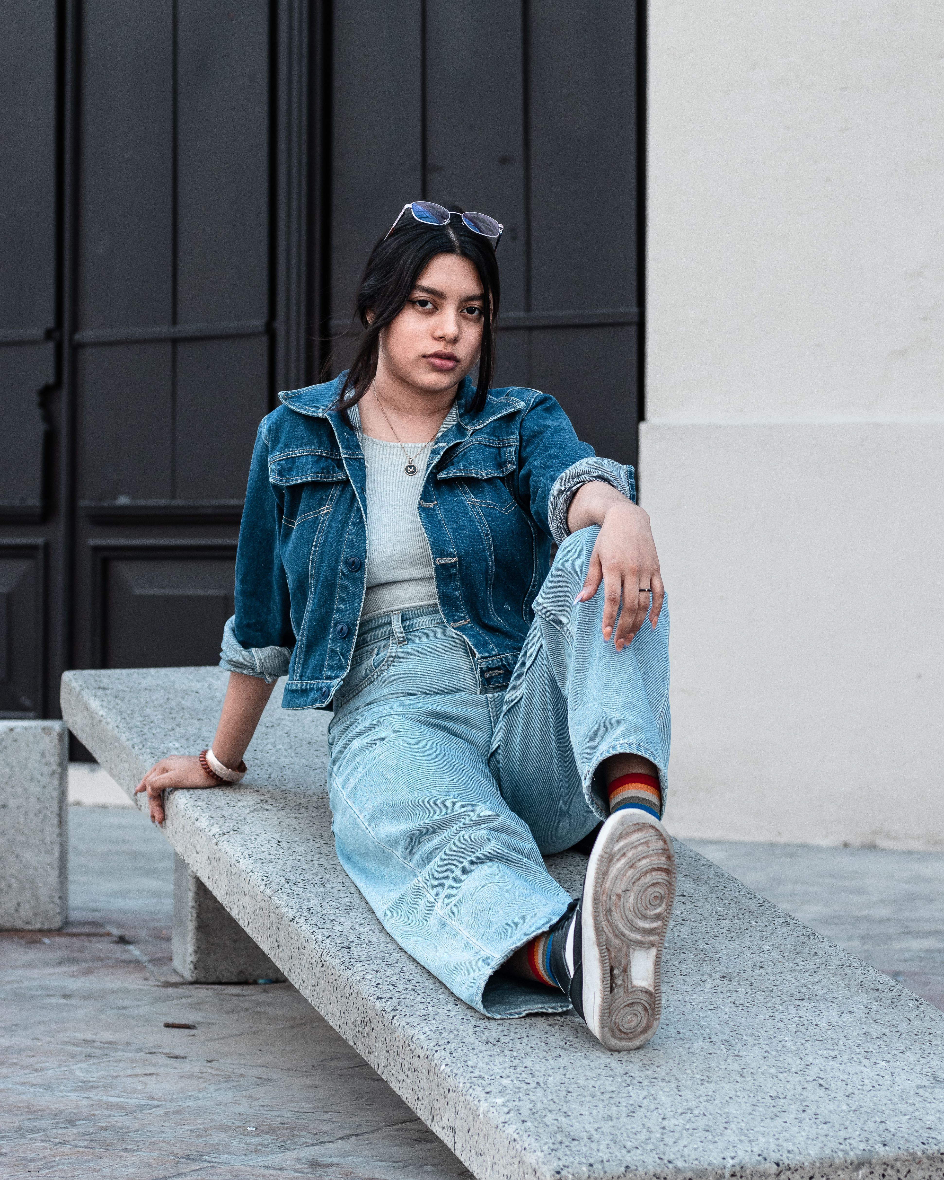 Photo of Woman laying on a Concrete Bench · Free Stock Photo