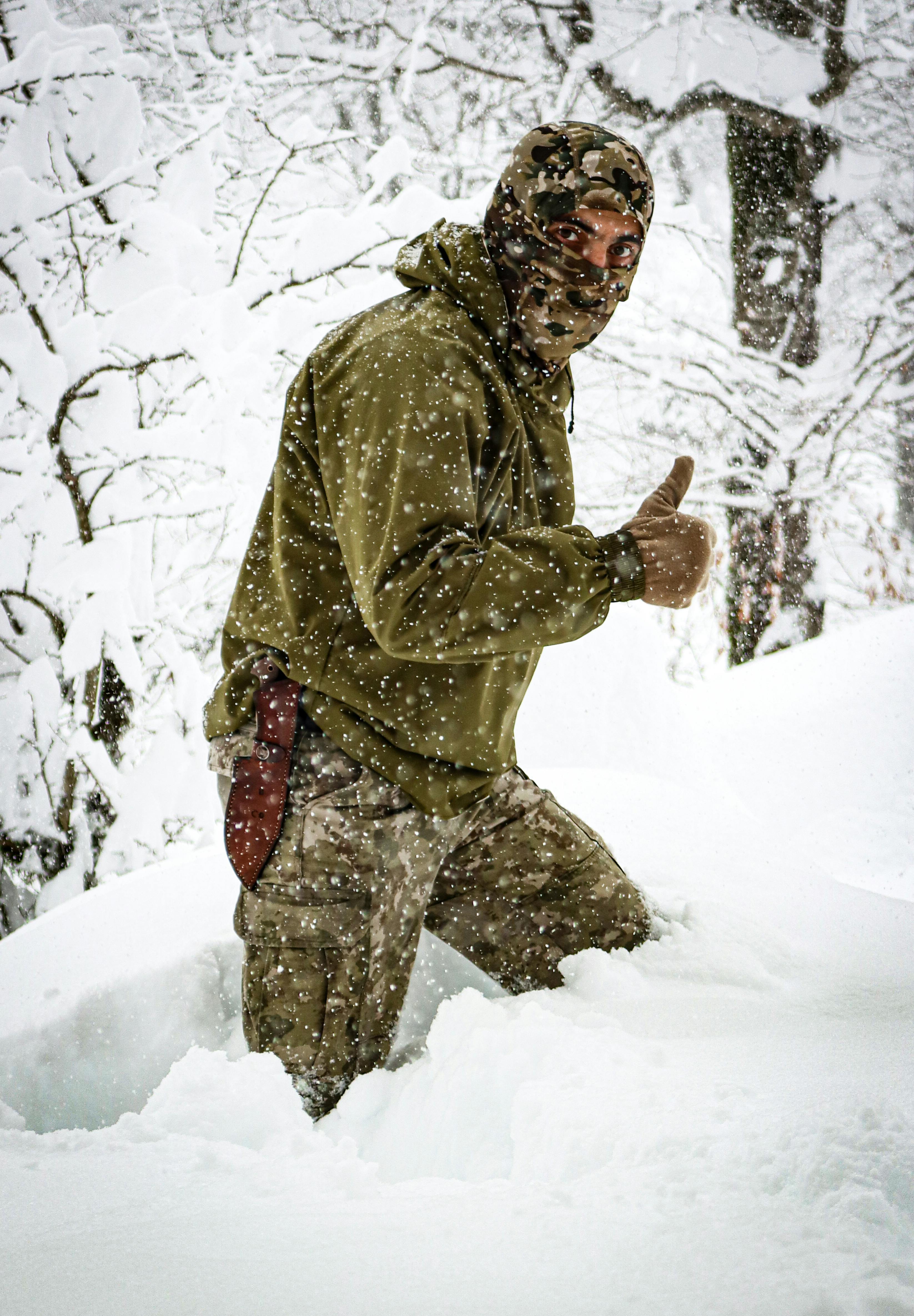 A Man Standing on Snow · Free Stock Photo