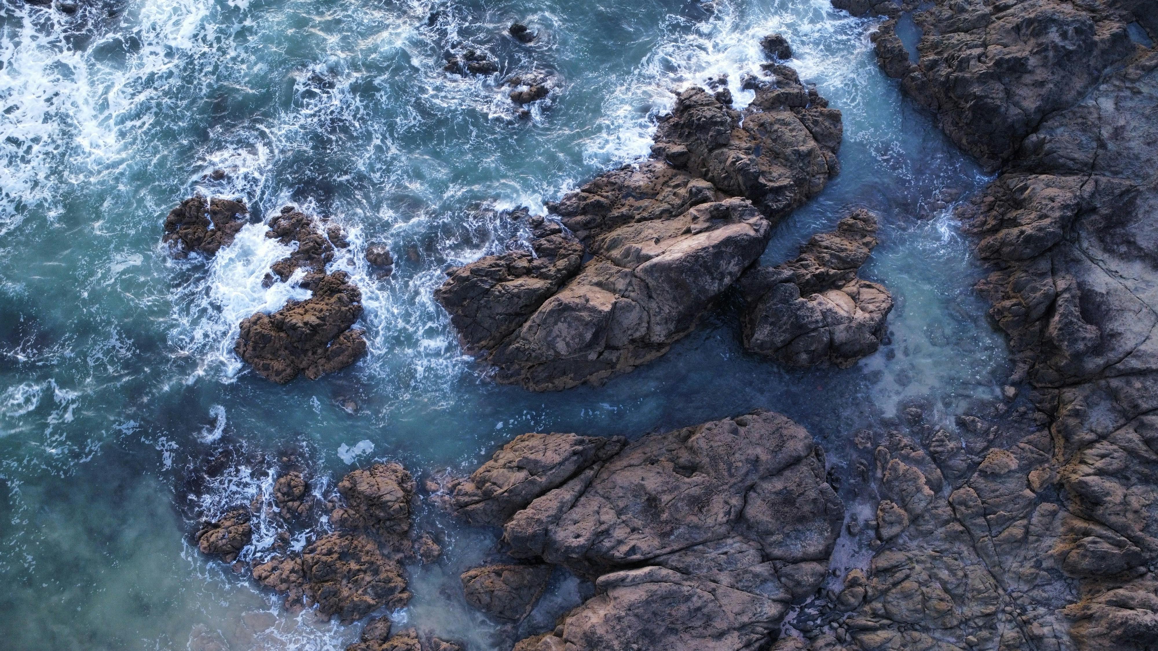 Top View Photo of Rocky Shore · Free Stock Photo
