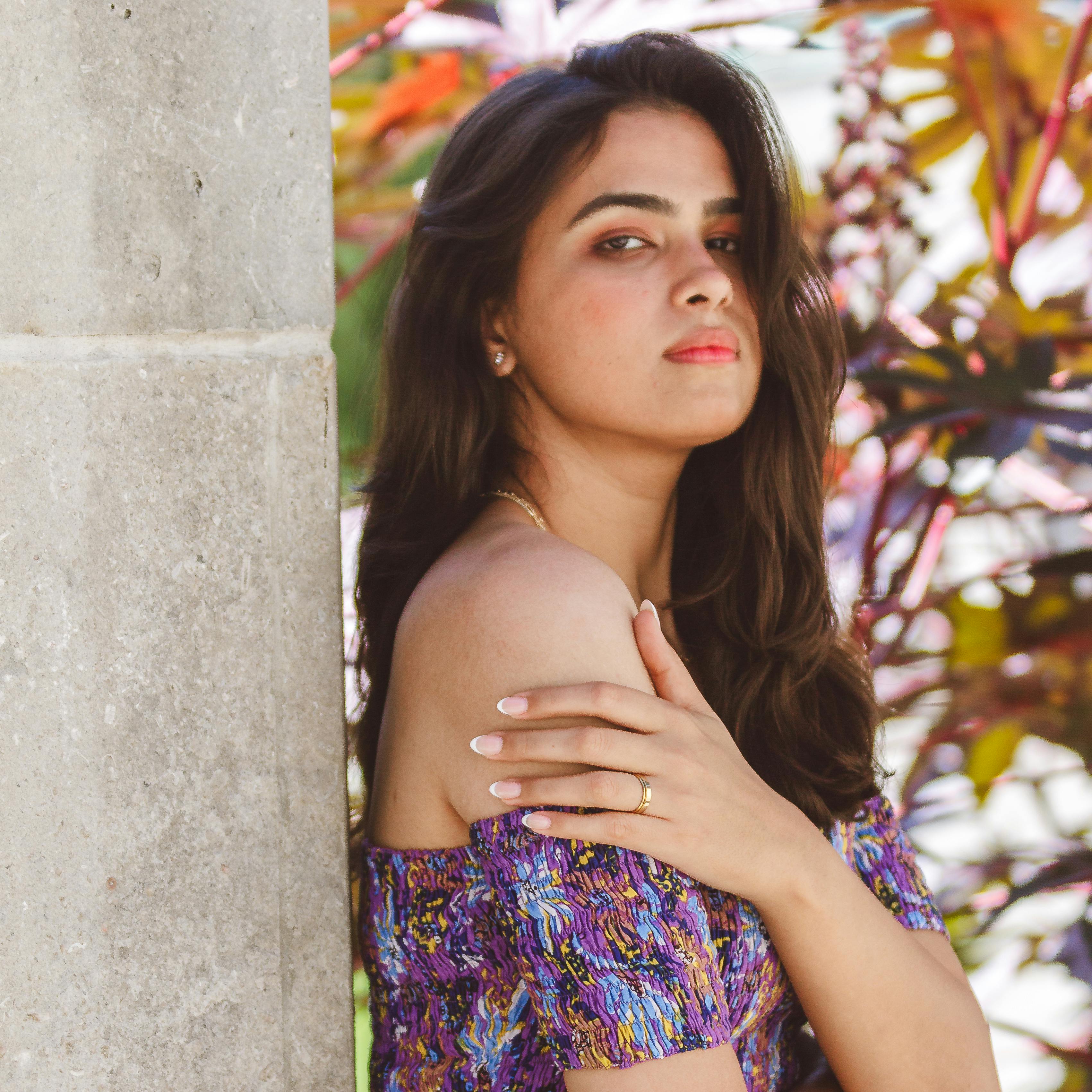 Woman Posing On A Concrete Post · Free Stock Photo