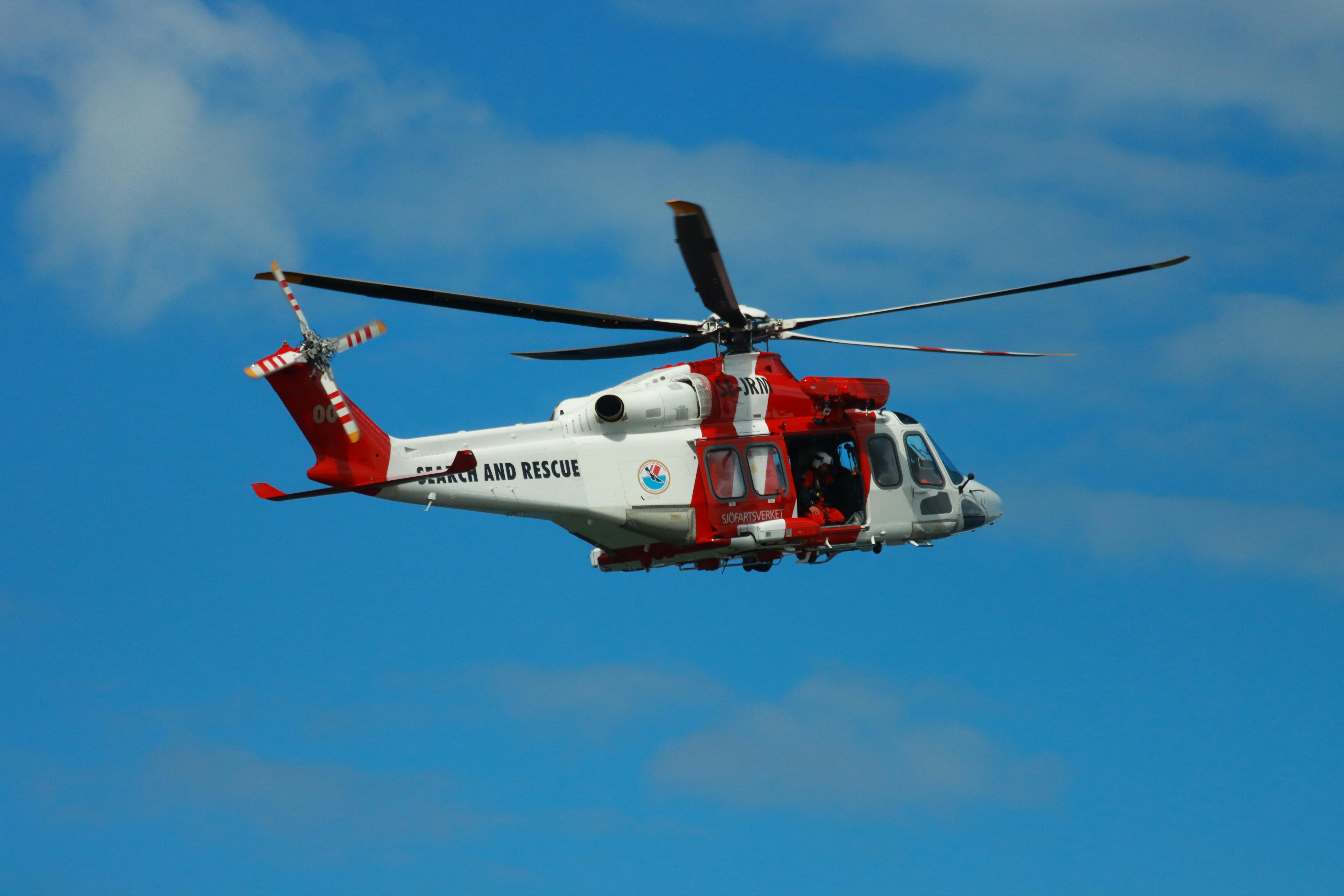 Flying Red and White Helicopter · Free Stock Photo