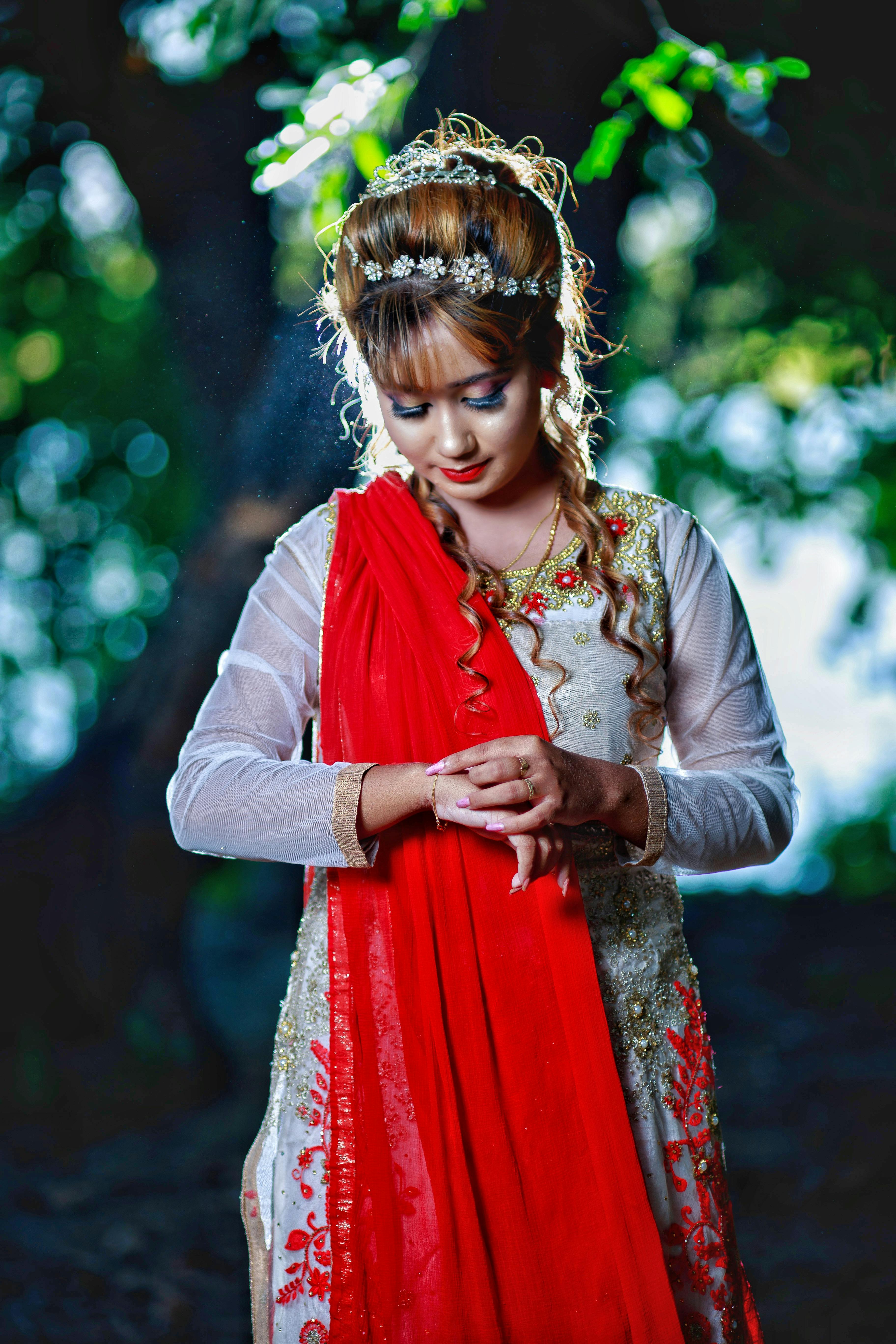 Woman Posing in Traditional Dress · Free Stock Photo