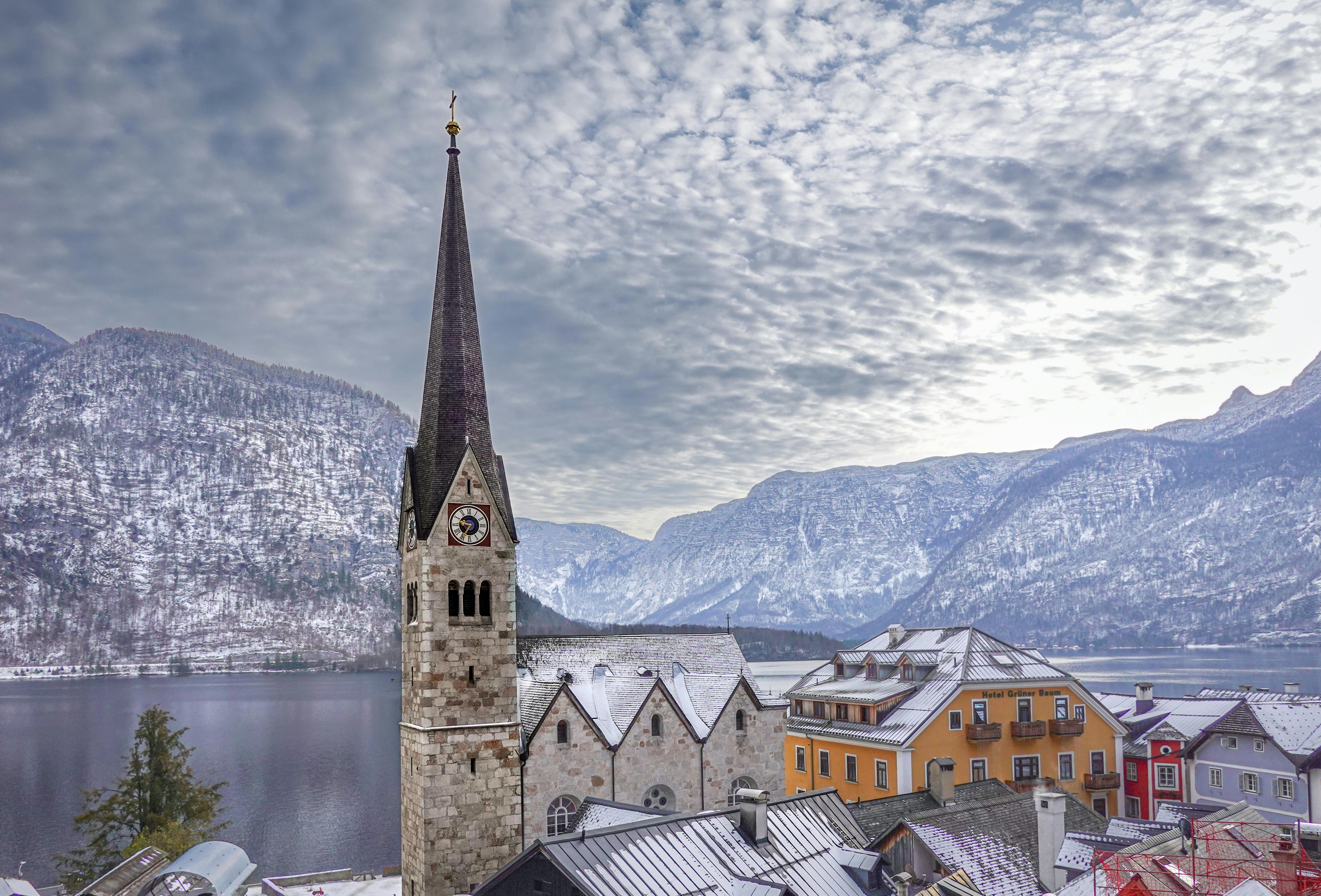 Gothic Church near Lake in Winter Mountains Landscape · Free Stock Photo