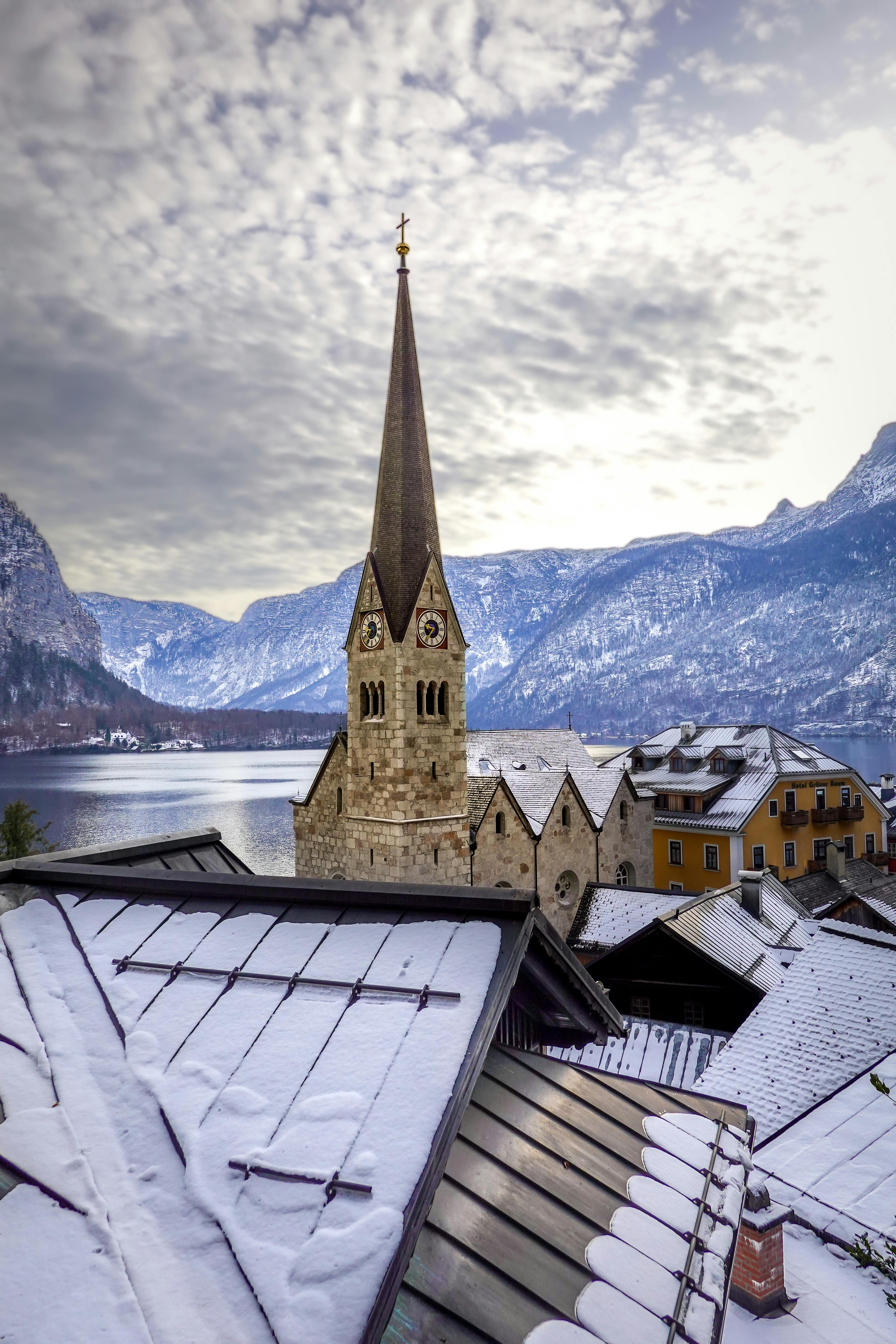Gothic Church near Lake in Winter Mountains Landscape · Free Stock Photo