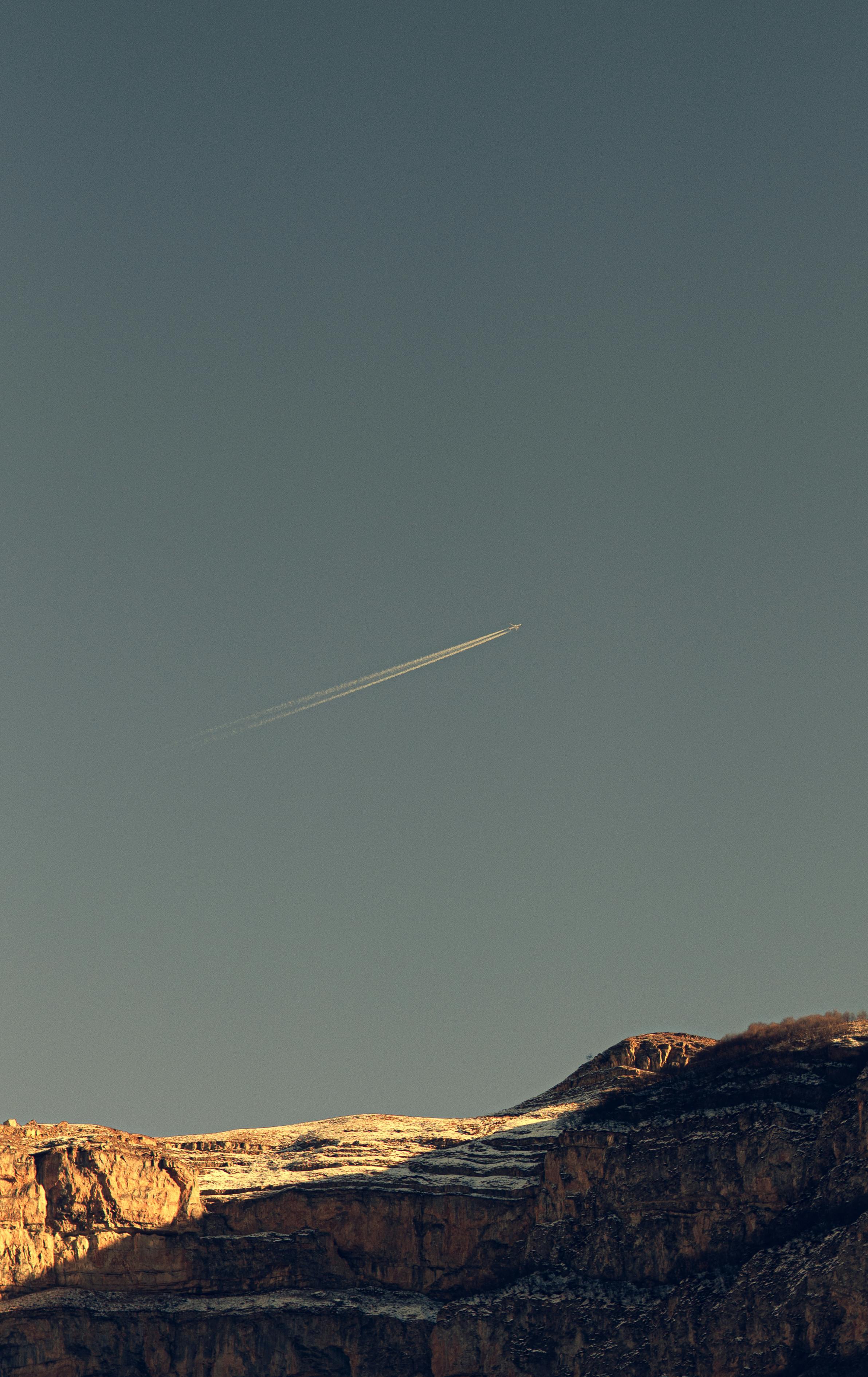 Airplane Contrail on a Clear Sky · Free Stock Photo