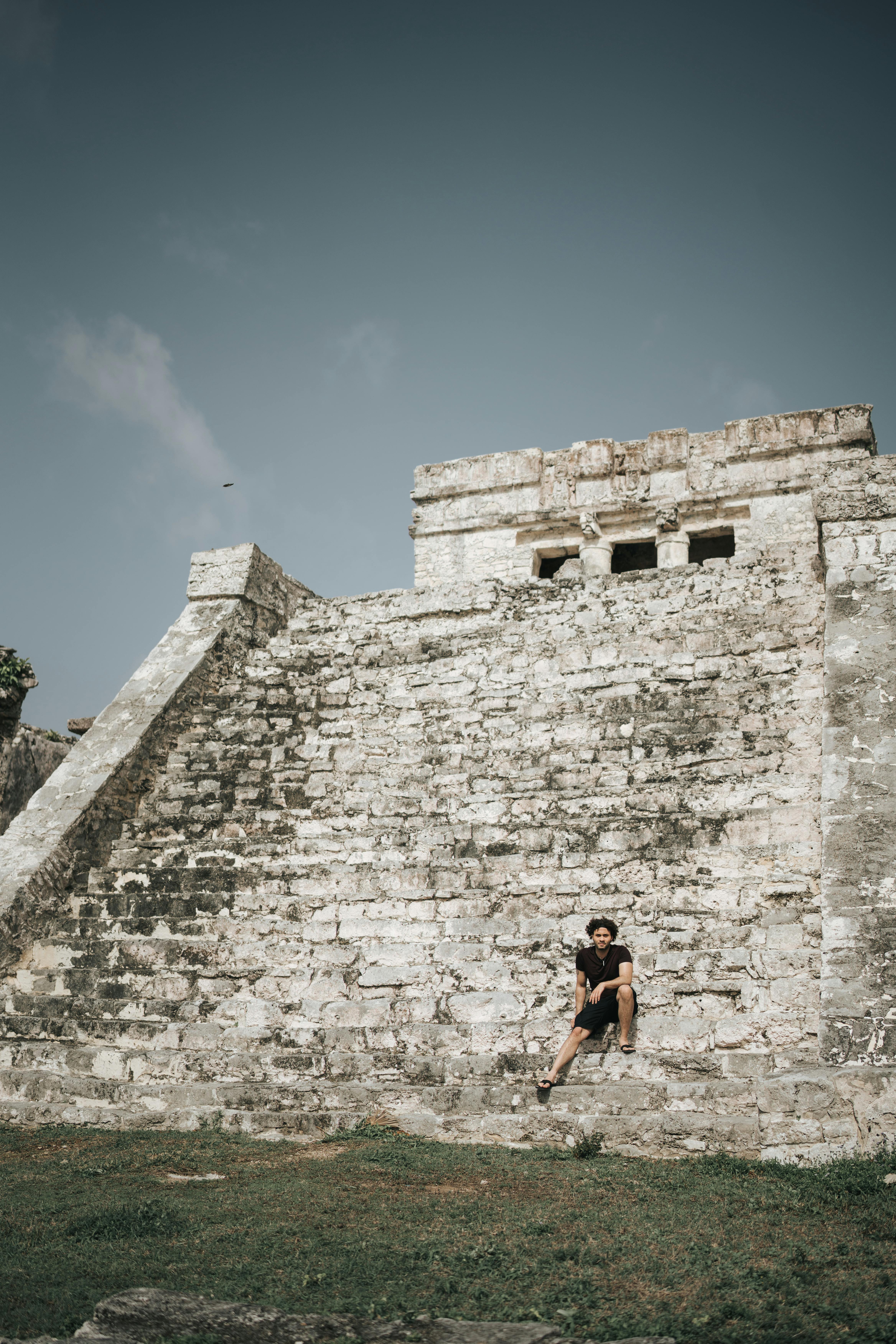 Person Sitting on Pyramid · Free Stock Photo