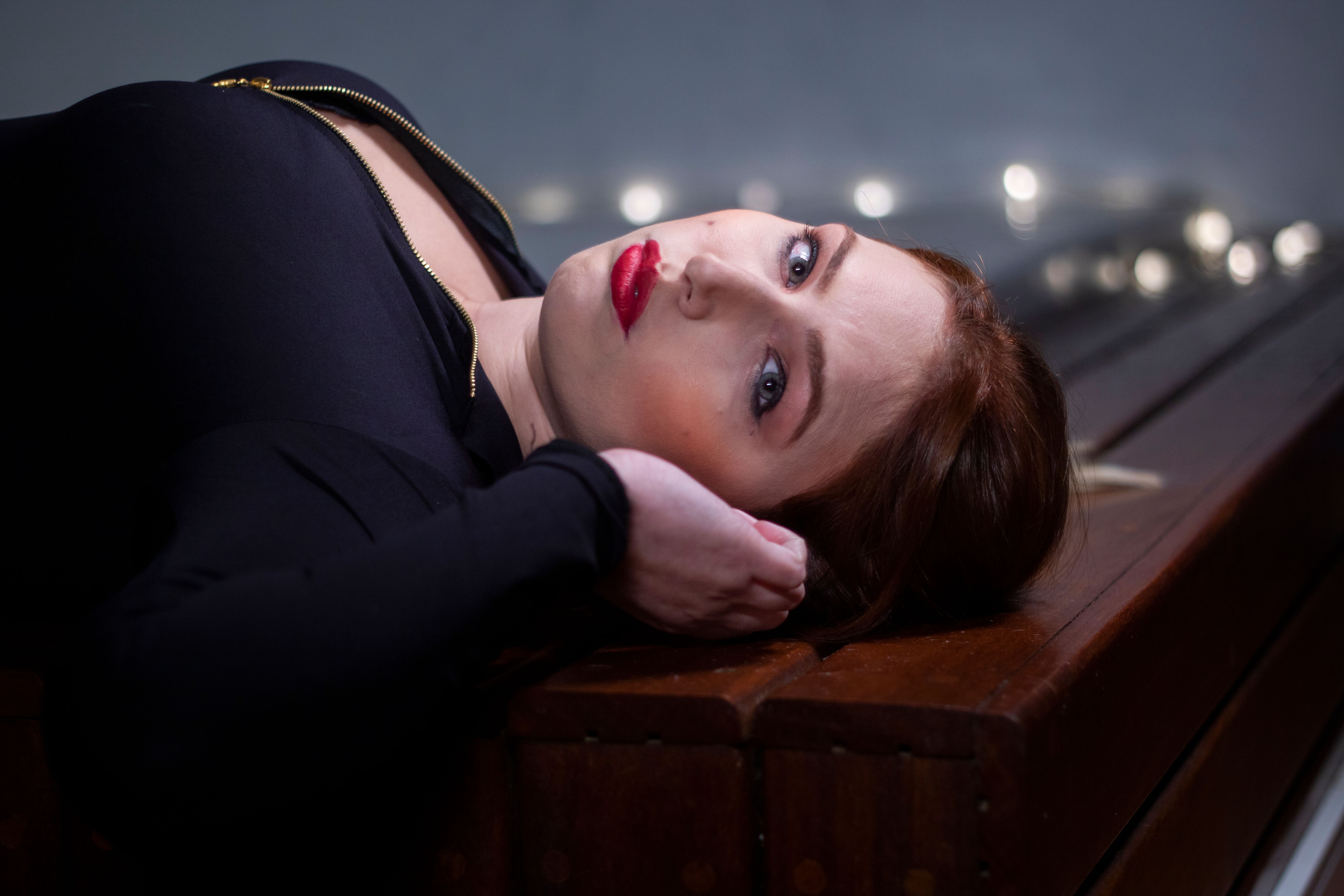 Woman Lying Down on Bench and Posing · Free Stock Photo