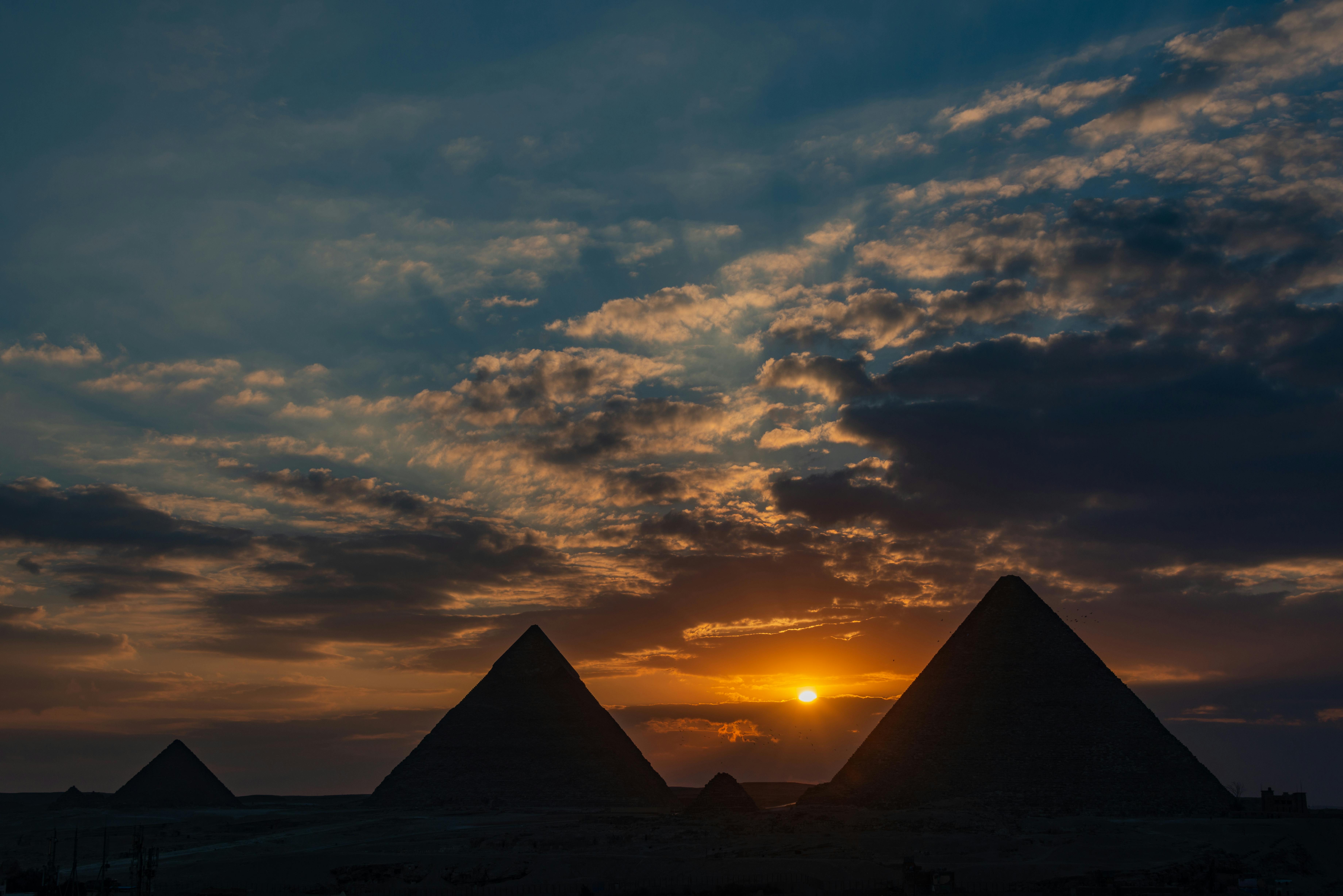 A Silhouette of the Pyramids in Giza during the Golden Hour · Free ...
