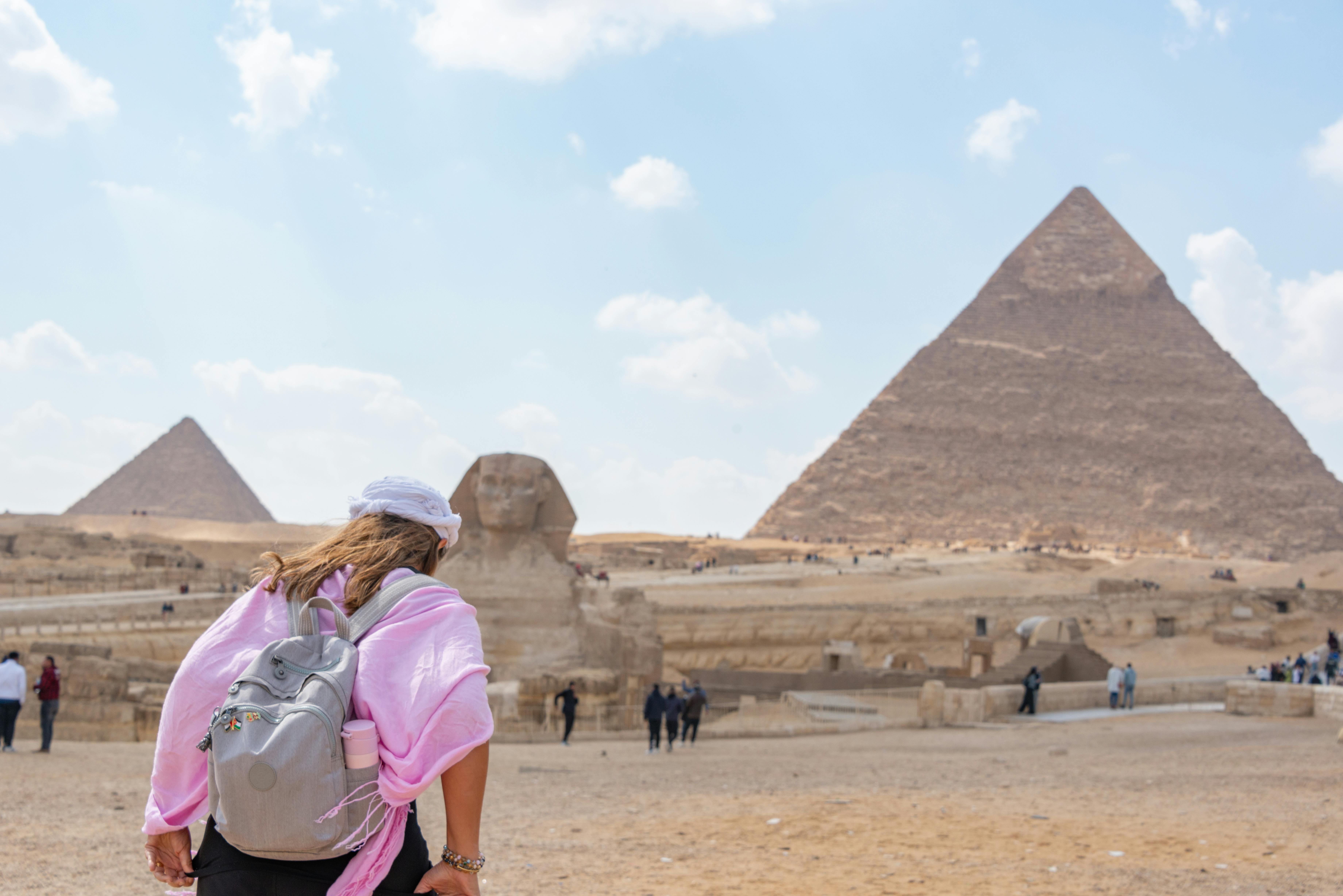 Woman Looking At Pyramids · Free Stock Photo