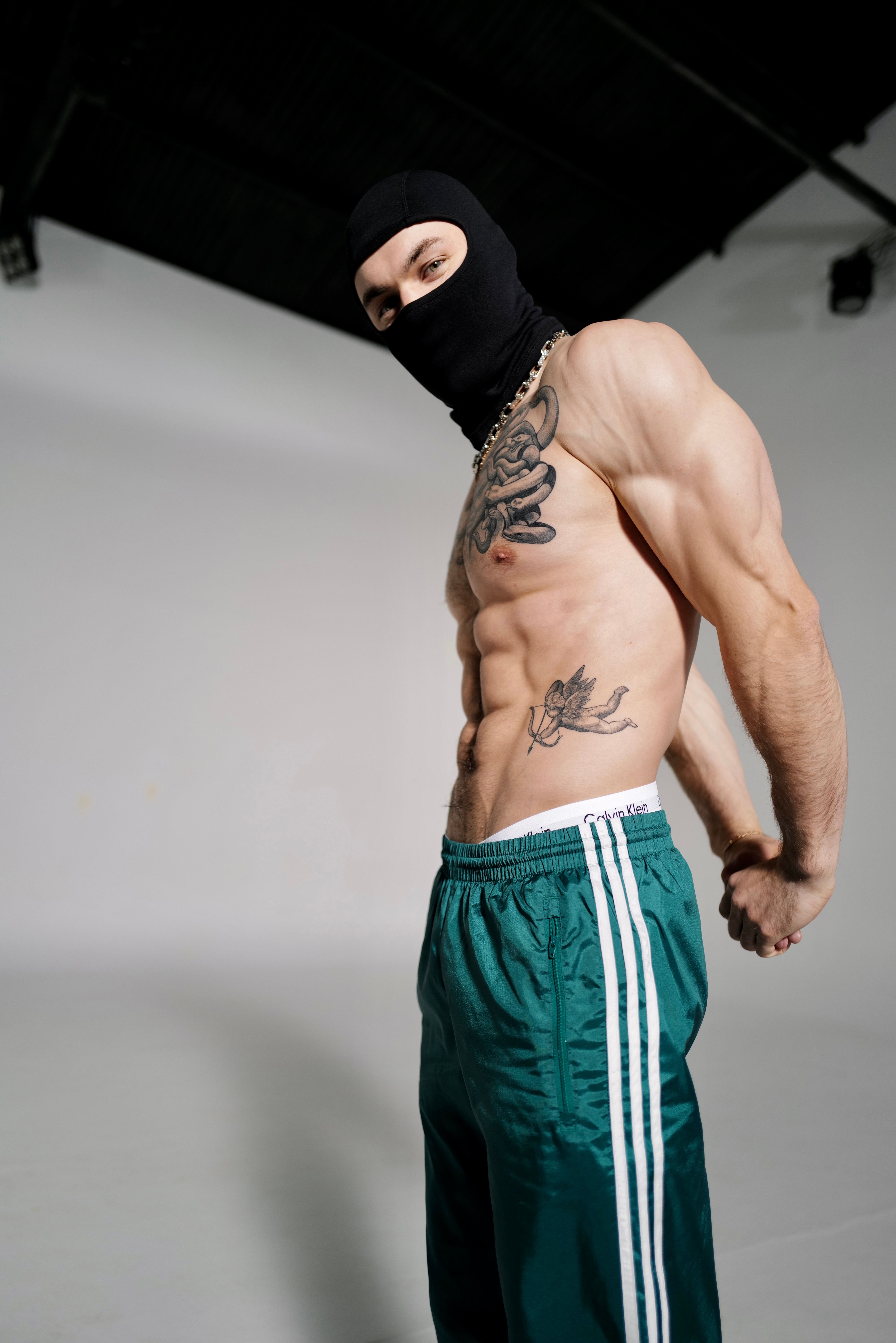 Shirtless Man in Balaclava Posing in Studio · Free Stock Photo