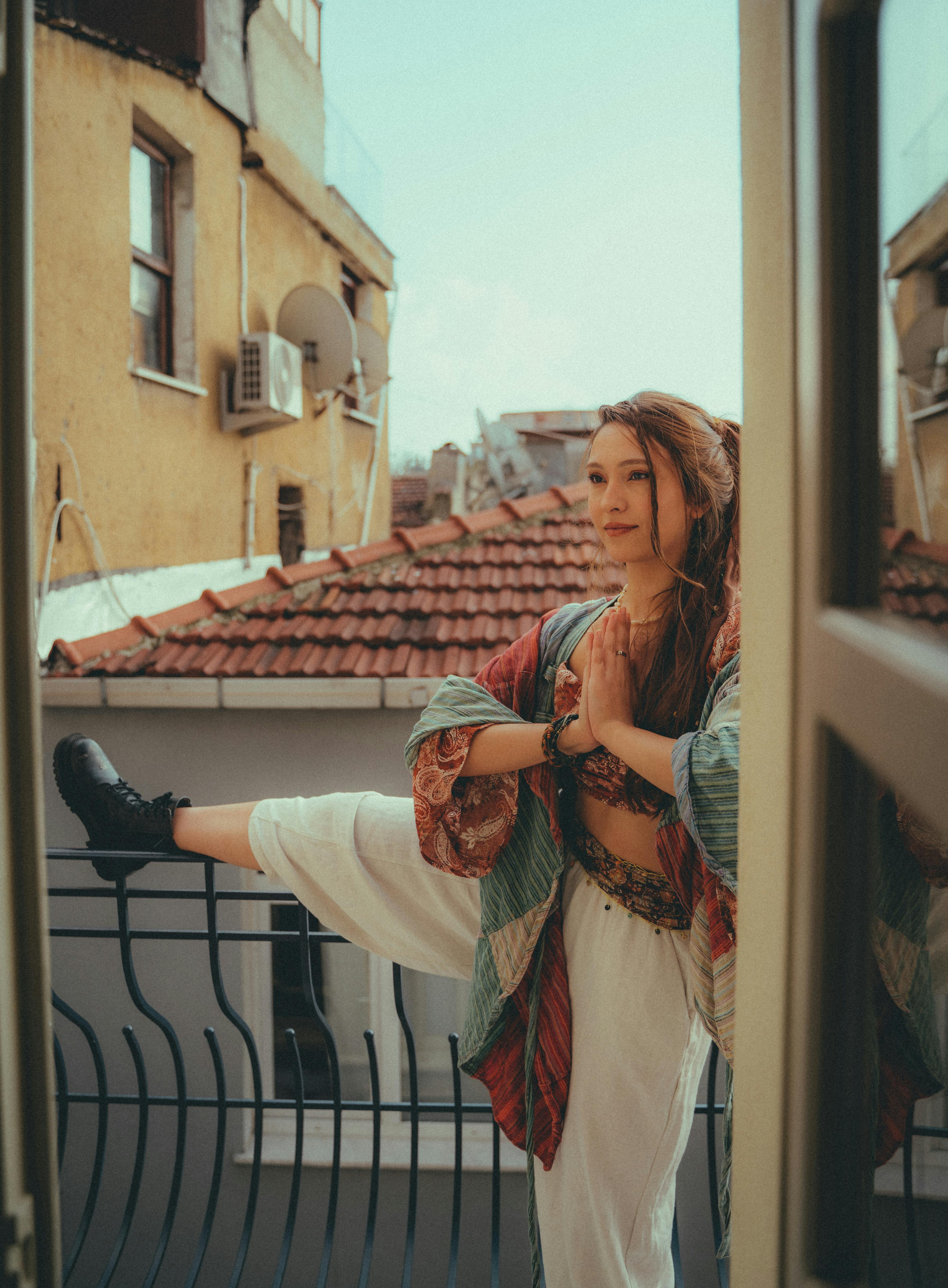 Woman Posing with Leg on Railing · Free Stock Photo