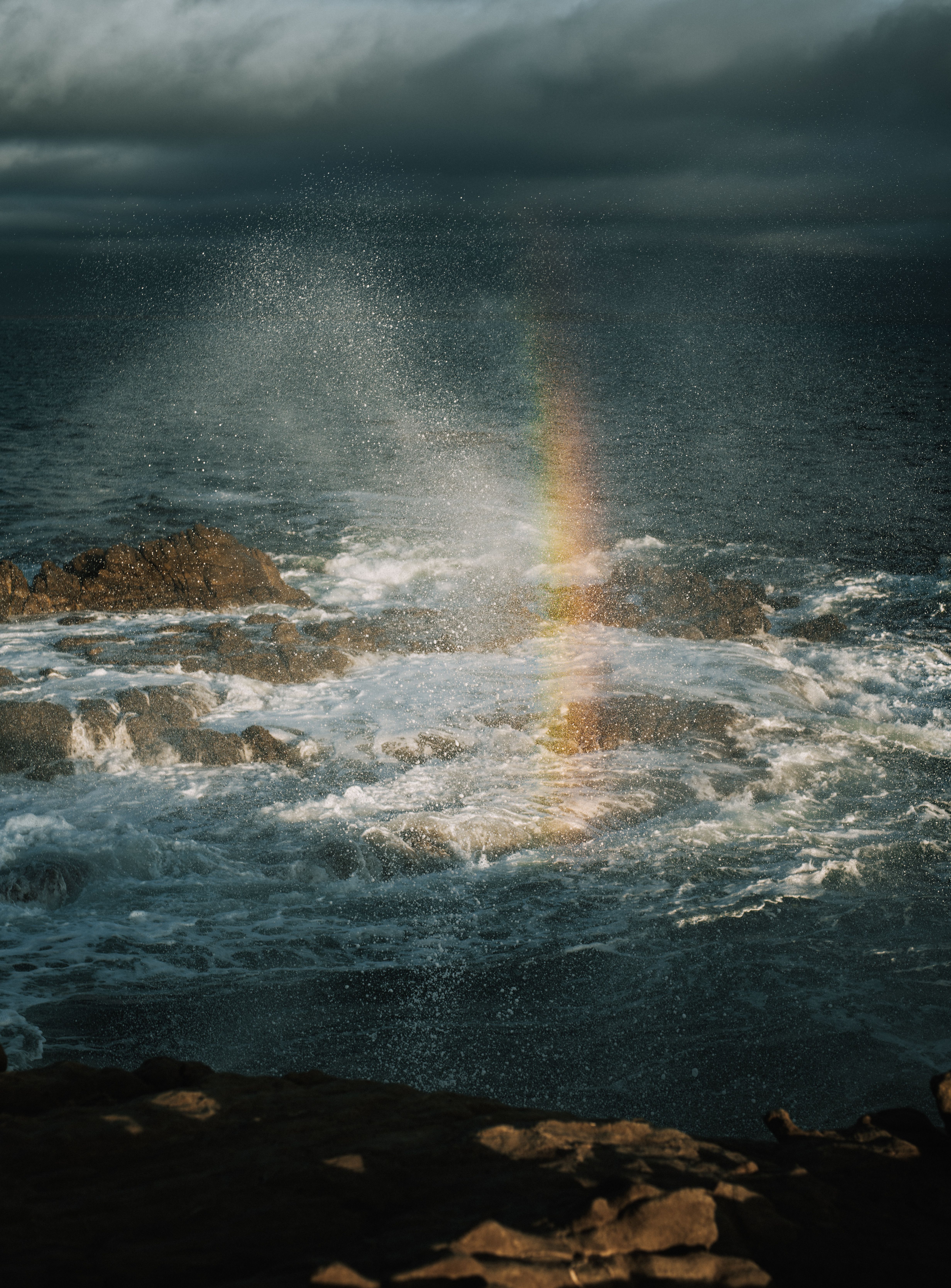 Rainbow over Sea Shore under Clouds · Free Stock Photo
