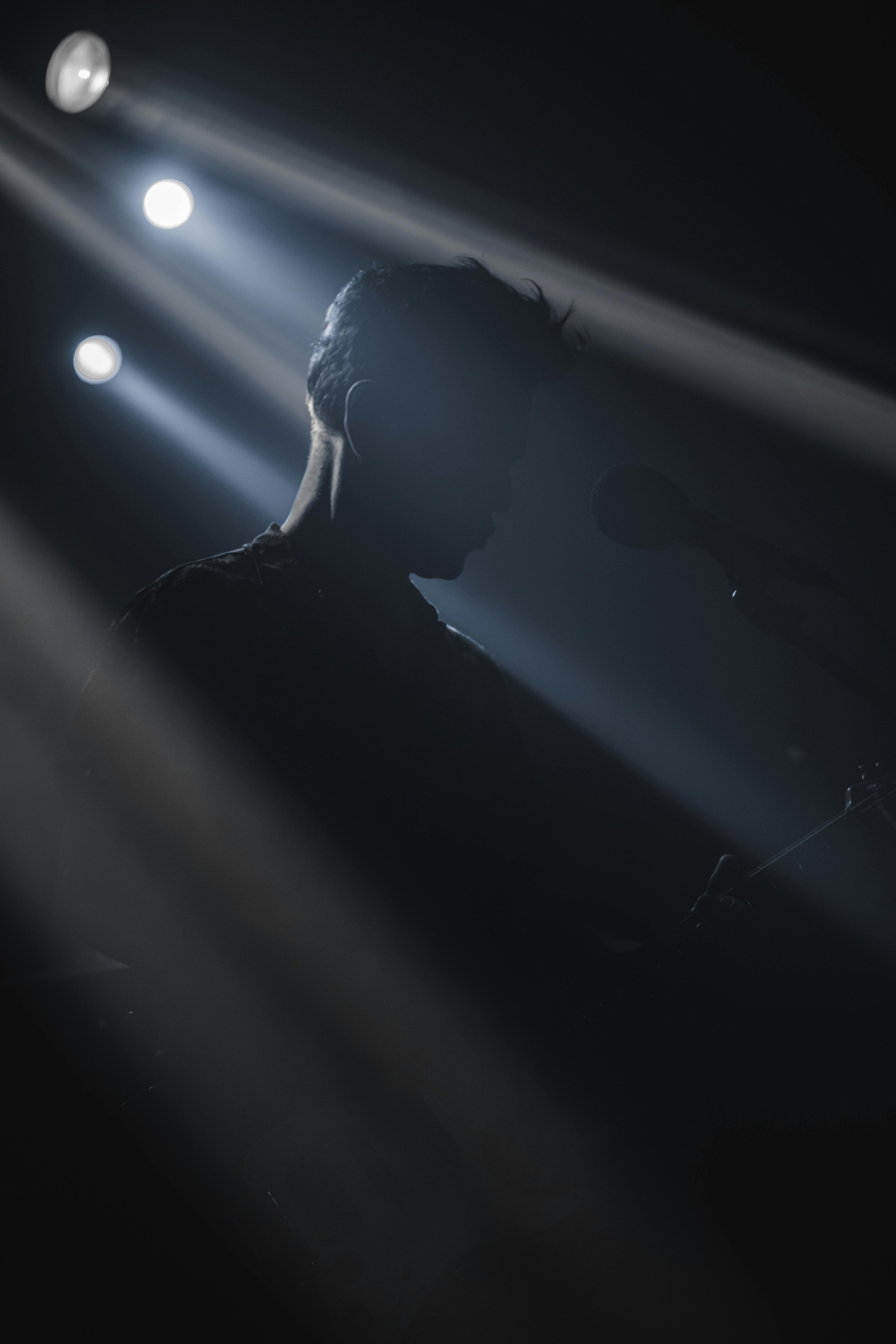 Silhouette of Man in Lights · Free Stock Photo