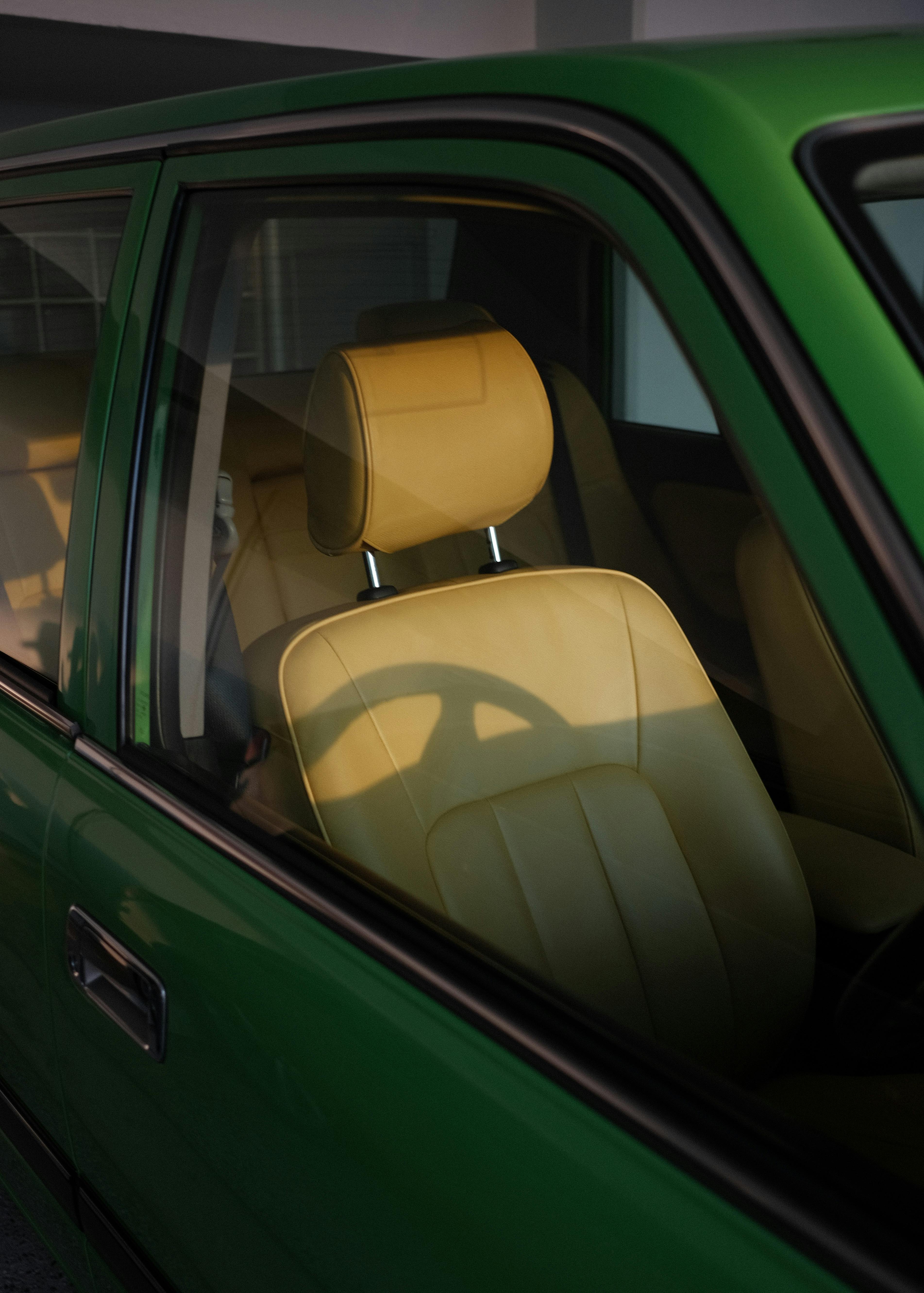 Vintage Car Seat seen through Window · Free Stock Photo