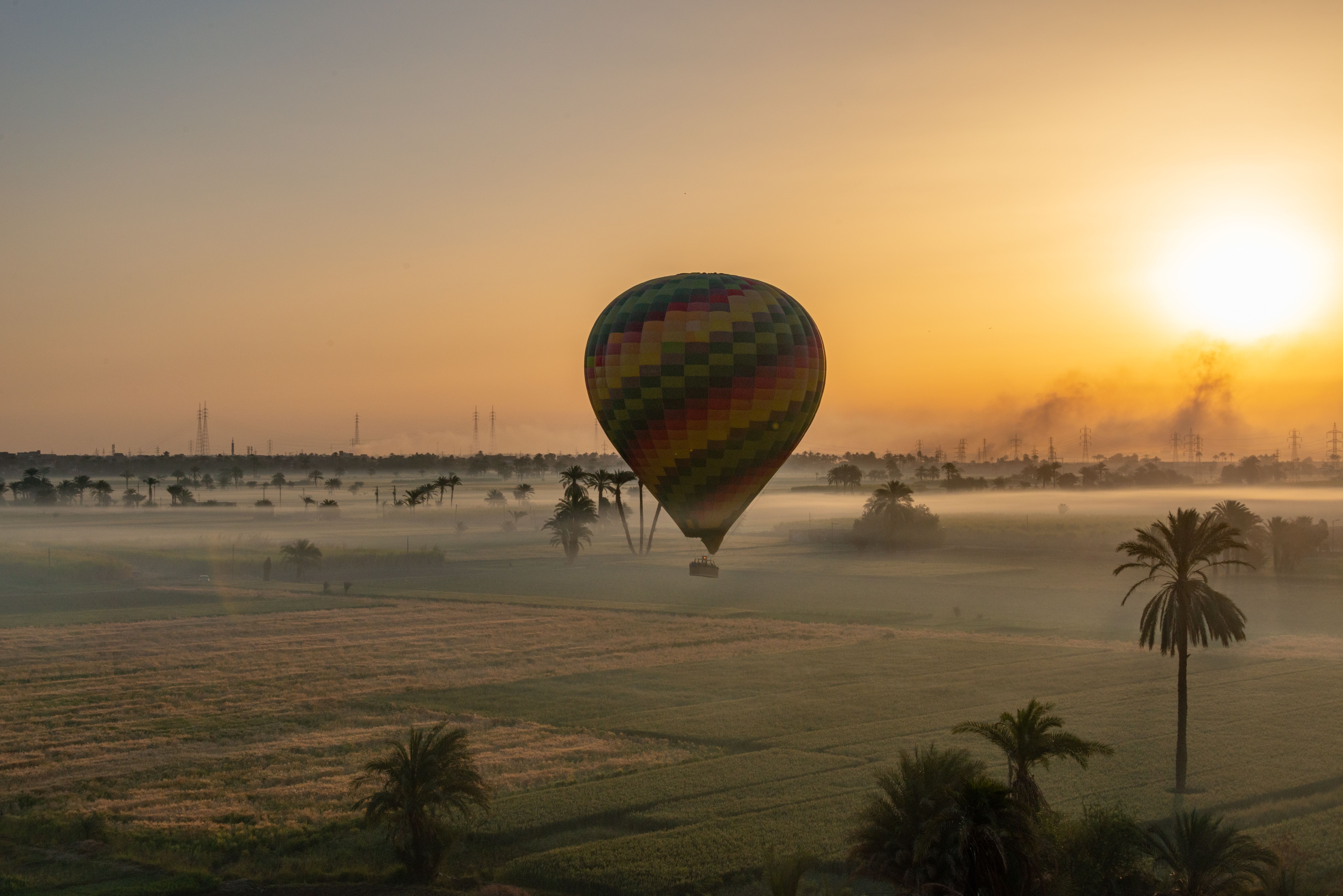 Hot Air Balloon over Field in Fog · Free Stock Photo