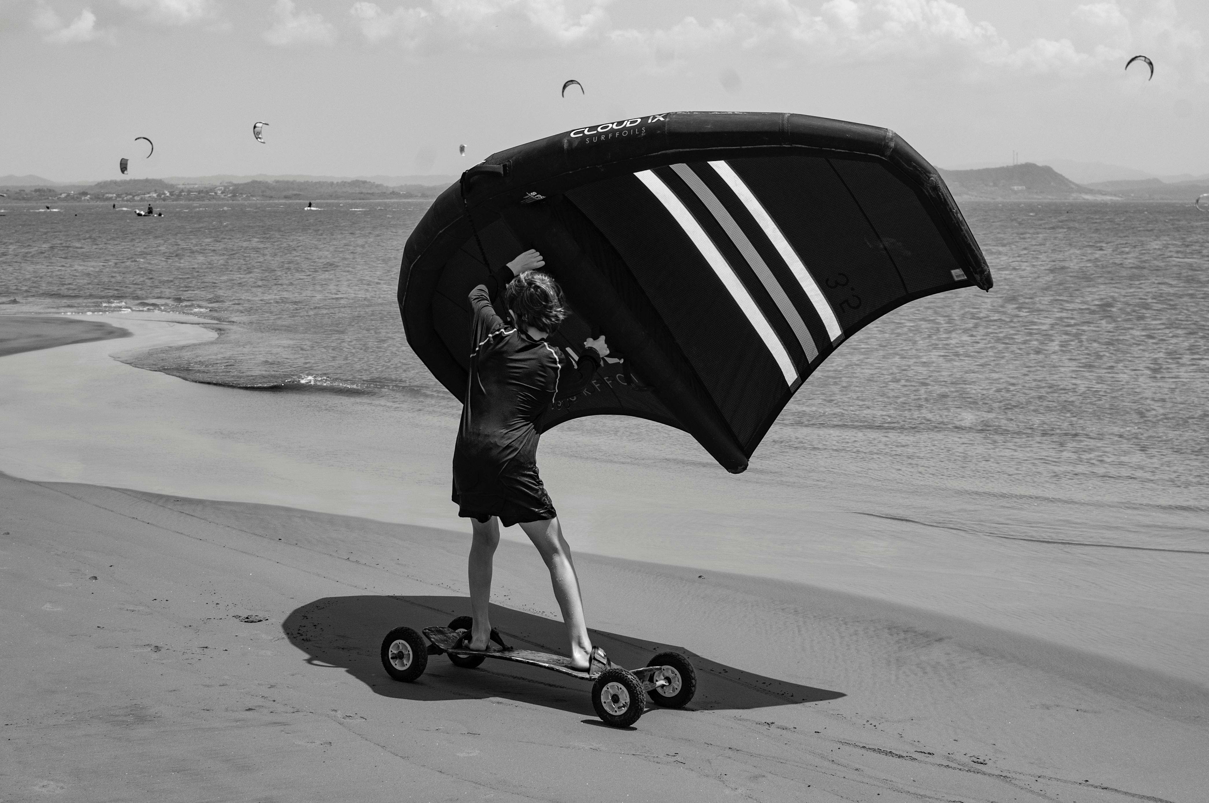 Wind Skateboarding along Sea · Free Stock Photo