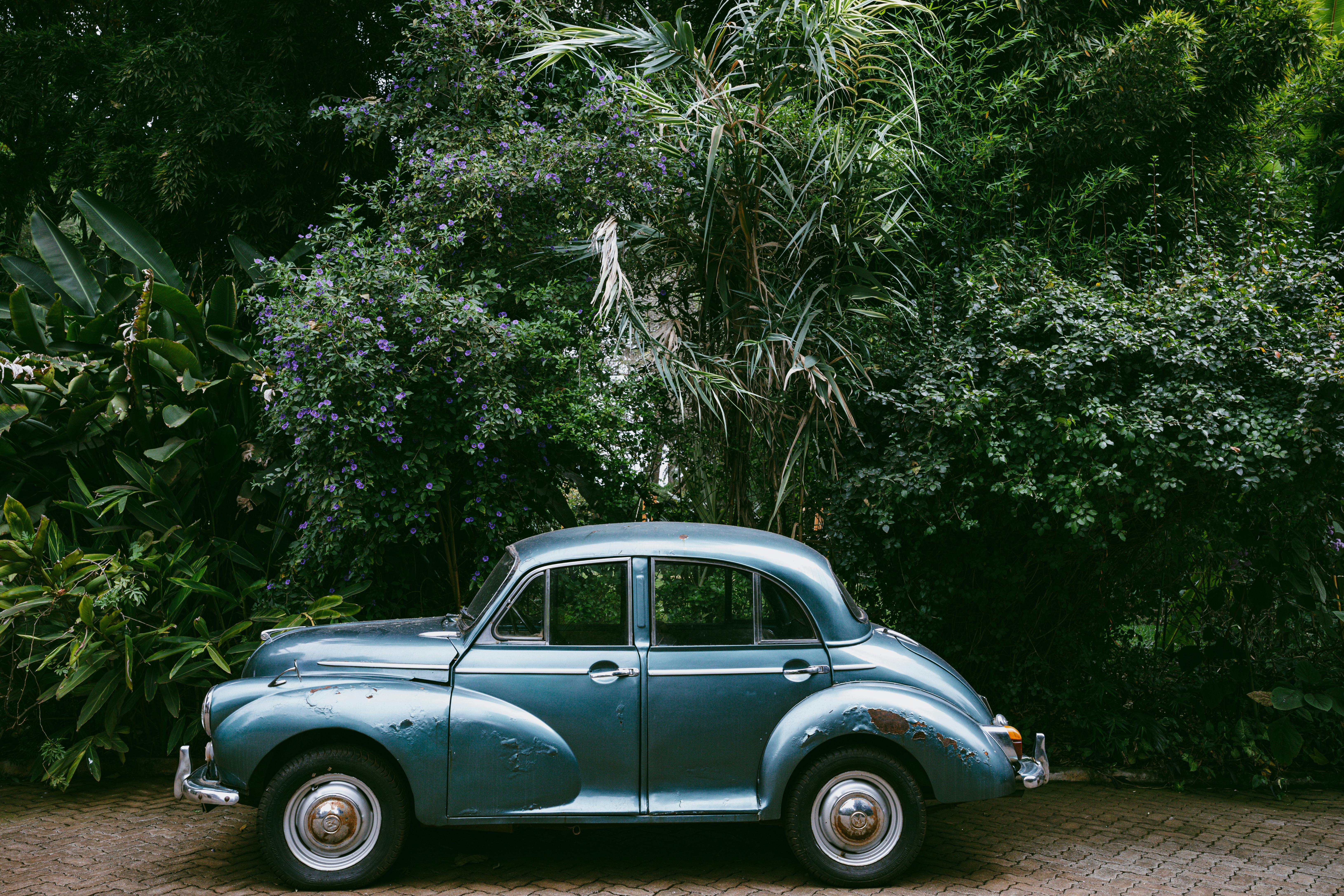 Vintage Blue Car Parked Near a Building · Free Stock Photo