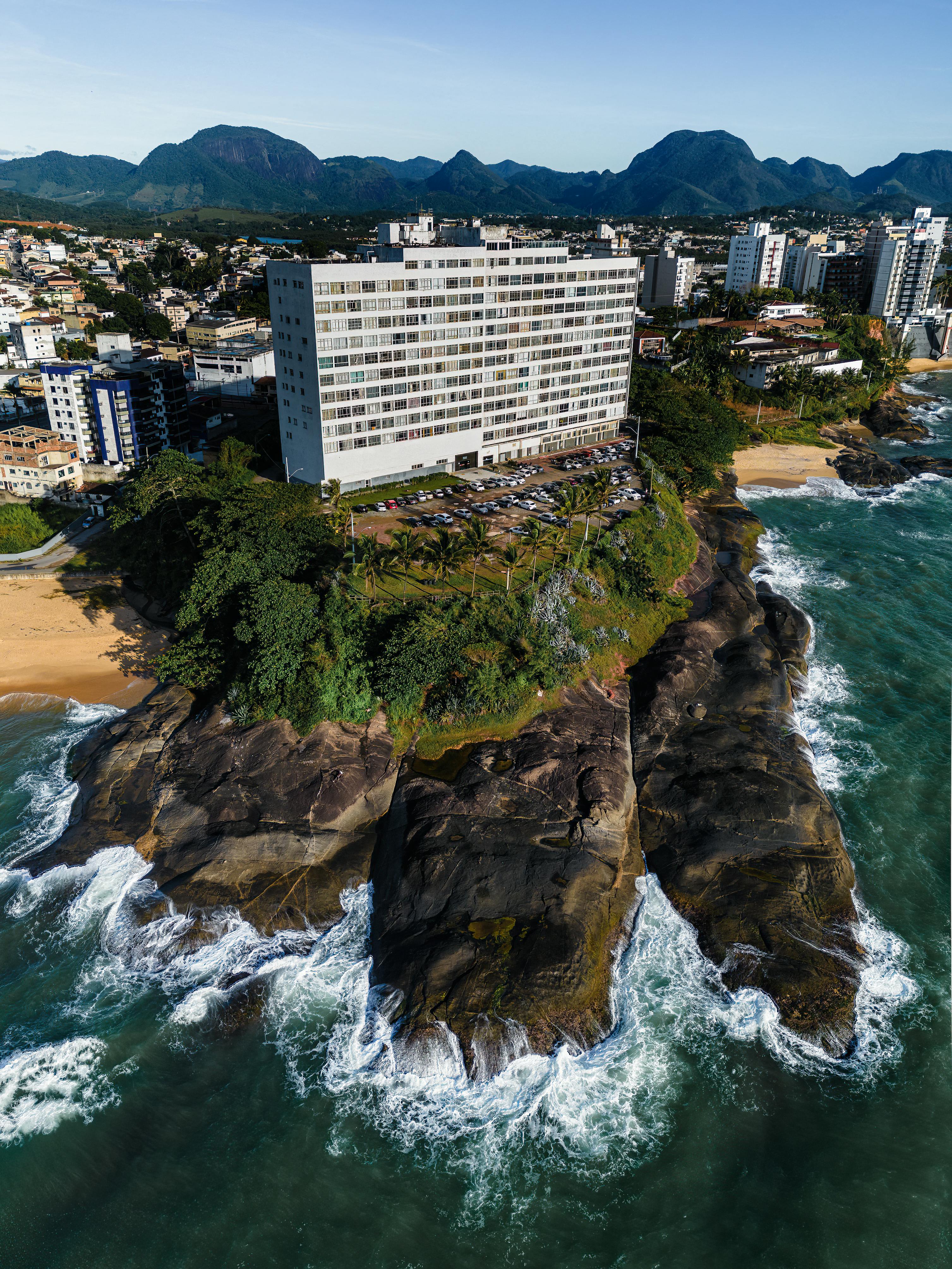 Hotel Built on Rock by Sea Shore · Free Stock Photo