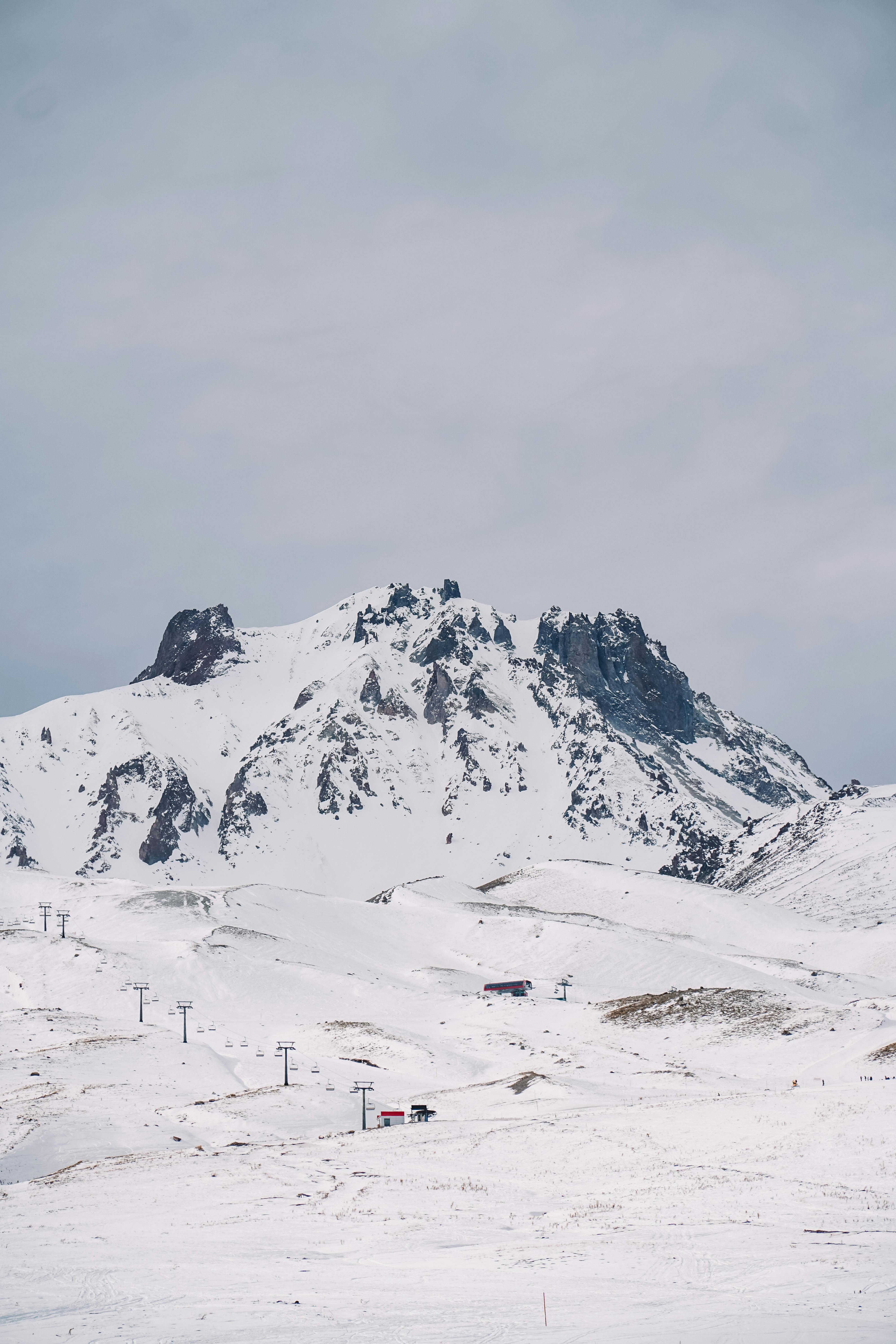 A sand dune with footprints in the sand · Free Stock Photo