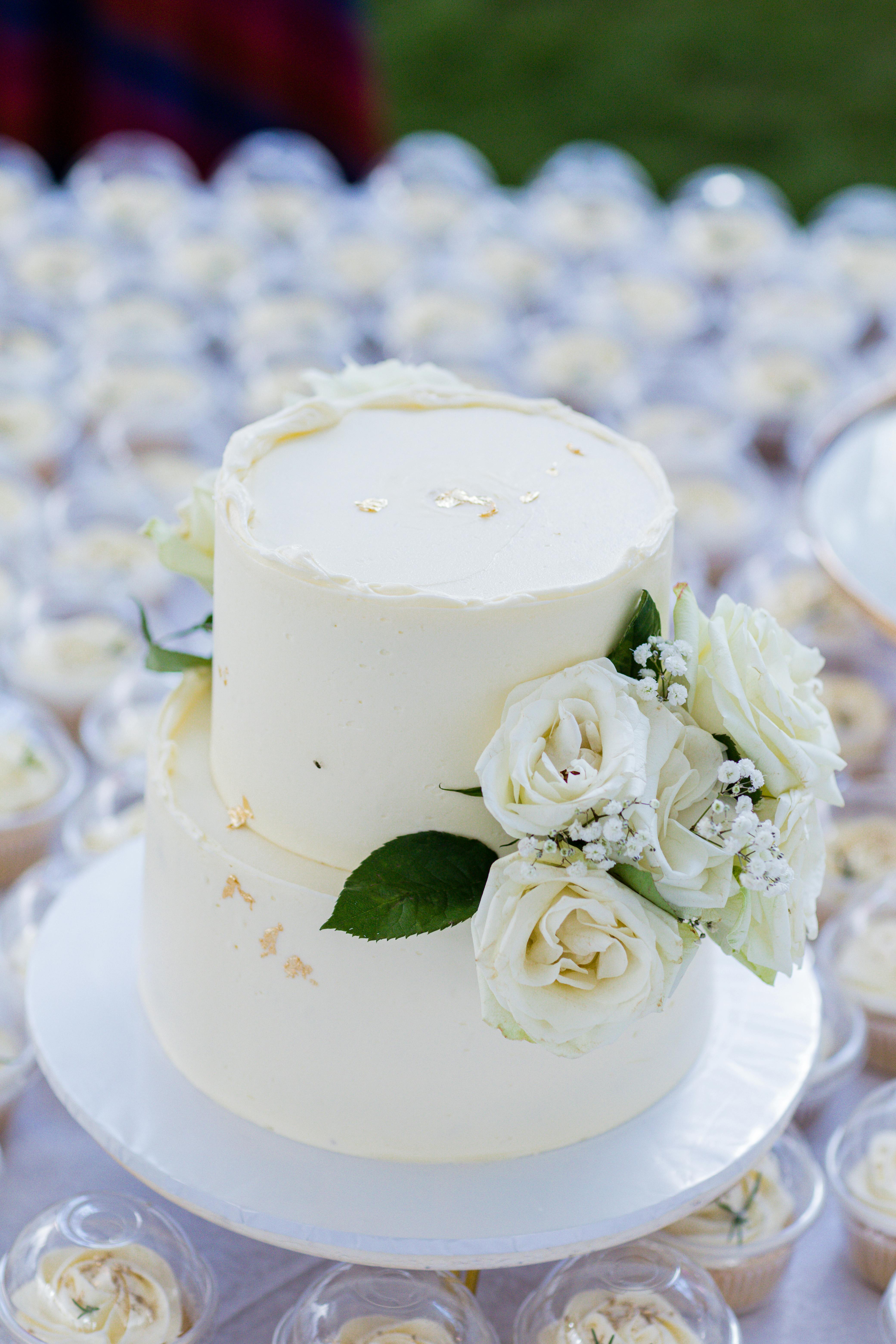 A Layer Cake on a Plinth and Desserts on Trays · Free Stock Photo