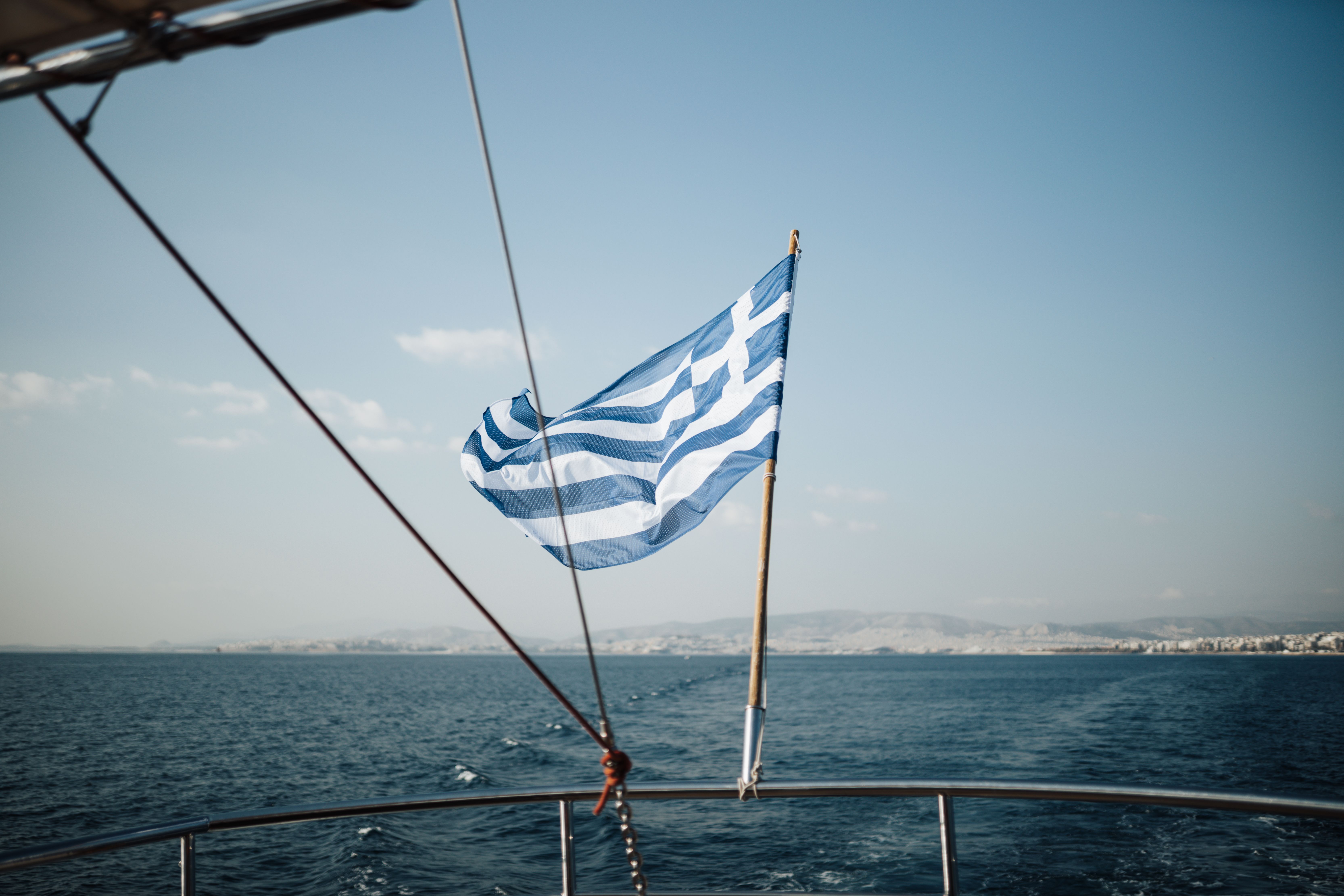 Greek Flag on Boat Sailing in the Aegean Sea · Free Stock Photo