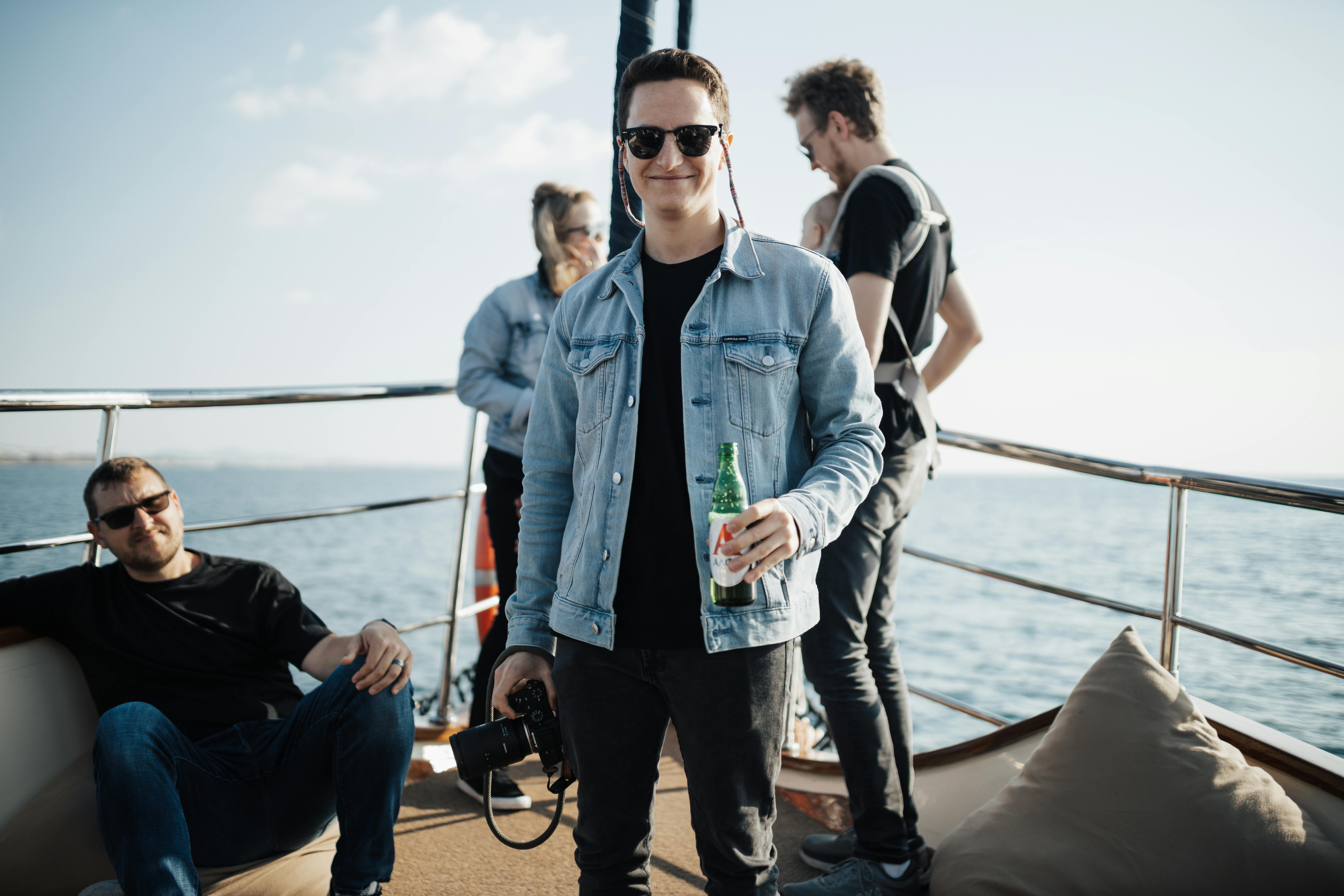 Friends Enjoying a Relaxing Day on a Boat · Free Stock Photo