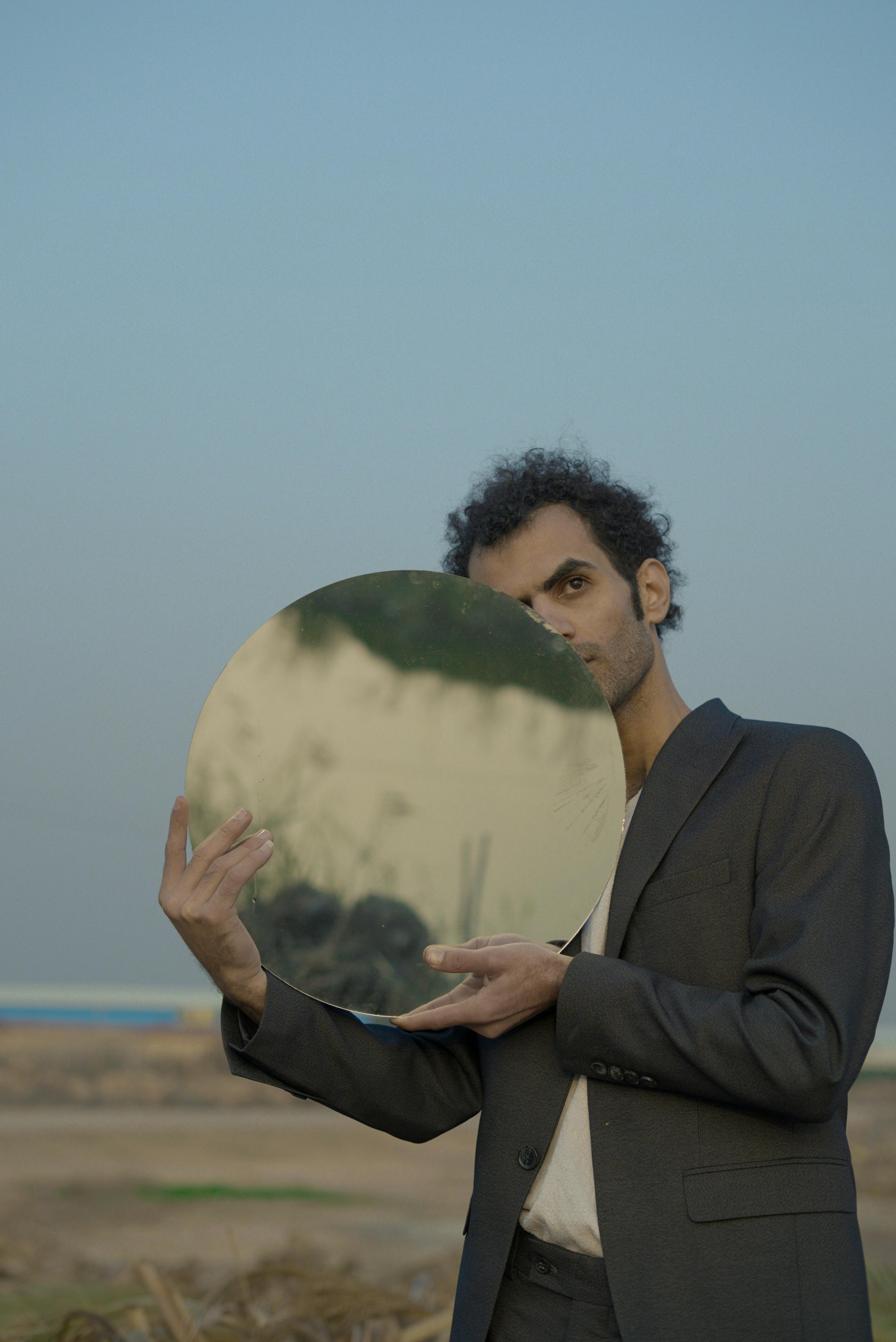 Man Holding a Mirror · Free Stock Photo