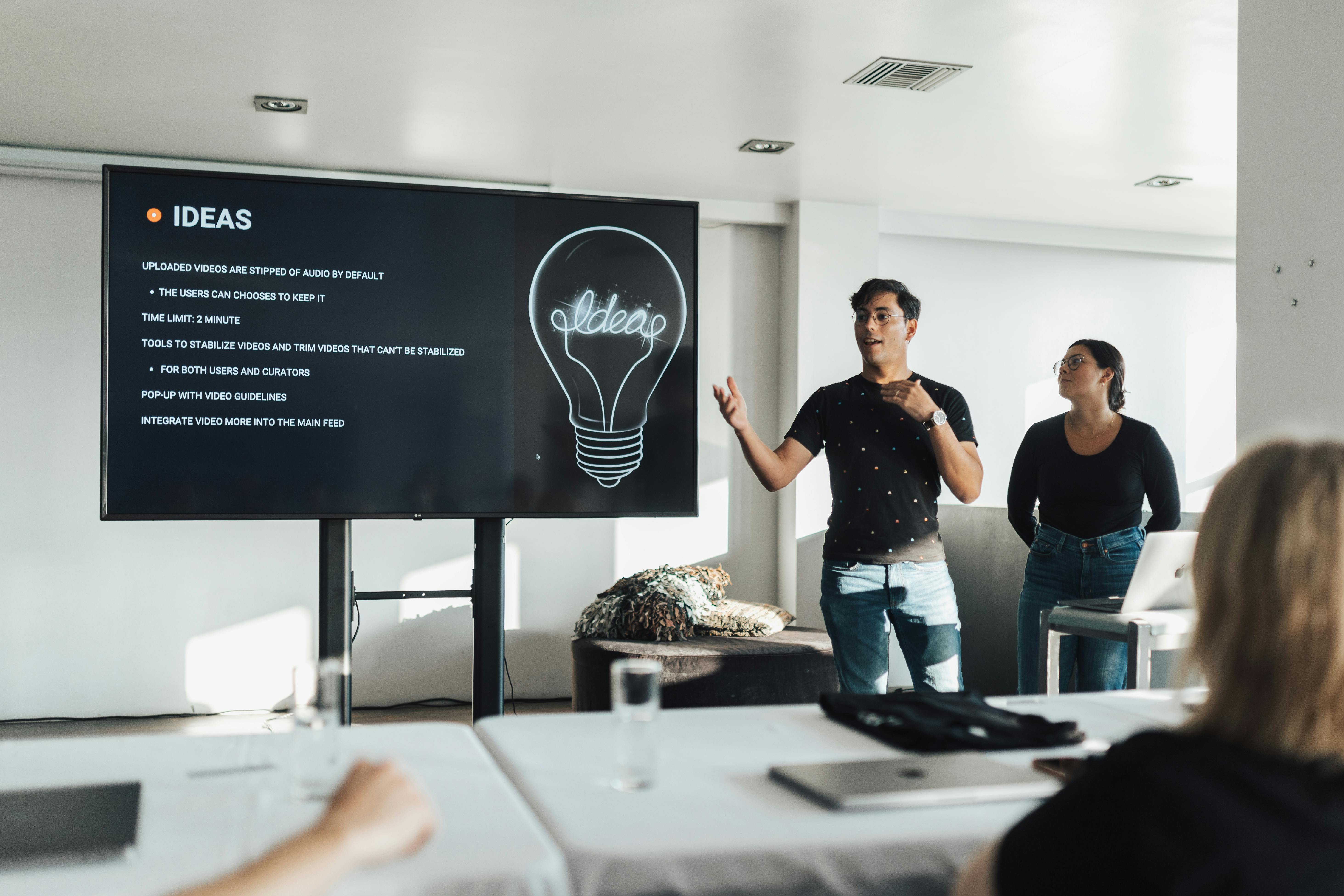 Man Showing a Presentation about his Idea in Meeting · Free Stock Photo