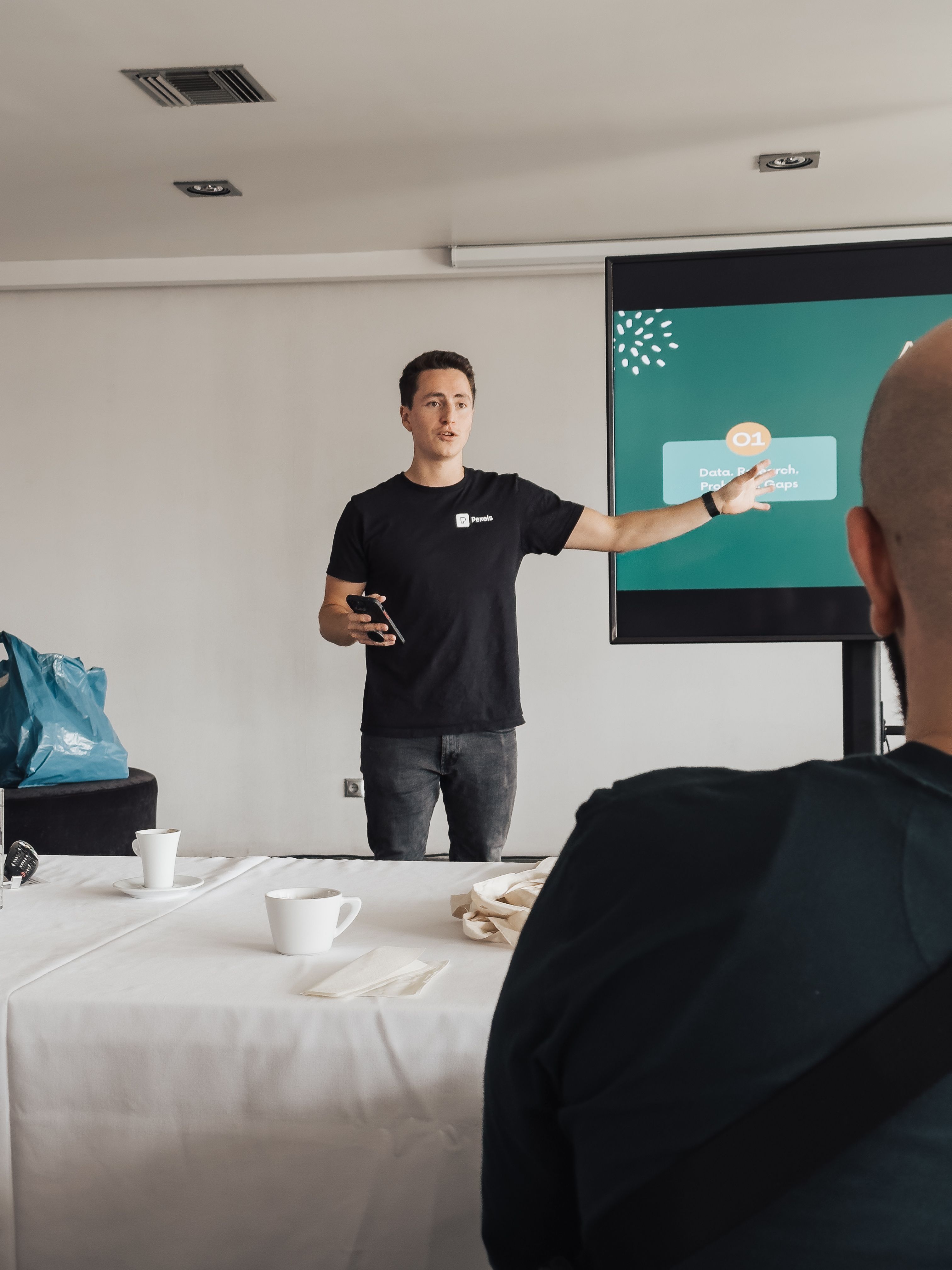 Standing Man Showing Presentation · Free Stock Photo
