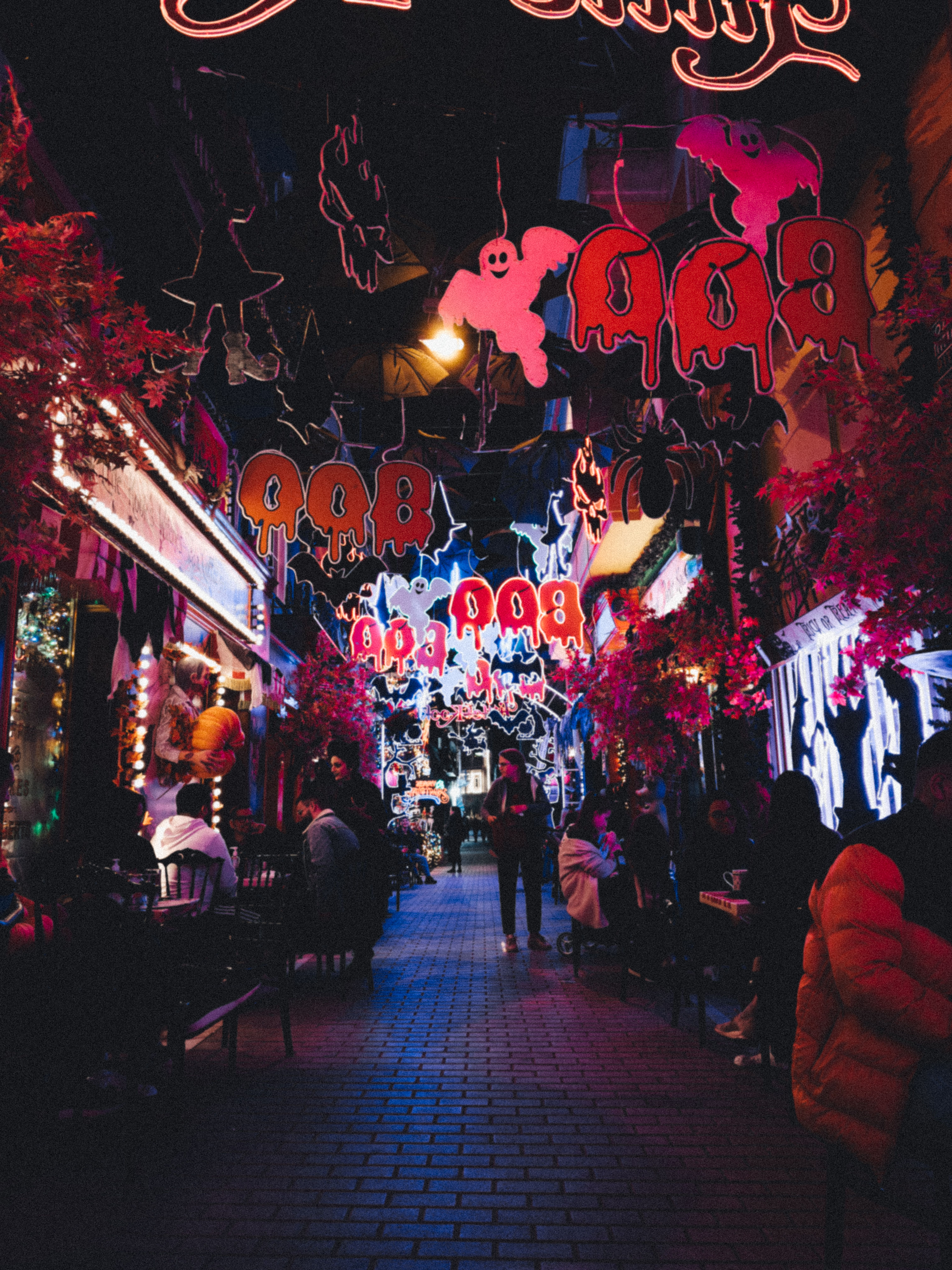 Vibrant Halloween Street Decor at Night · Free Stock Photo