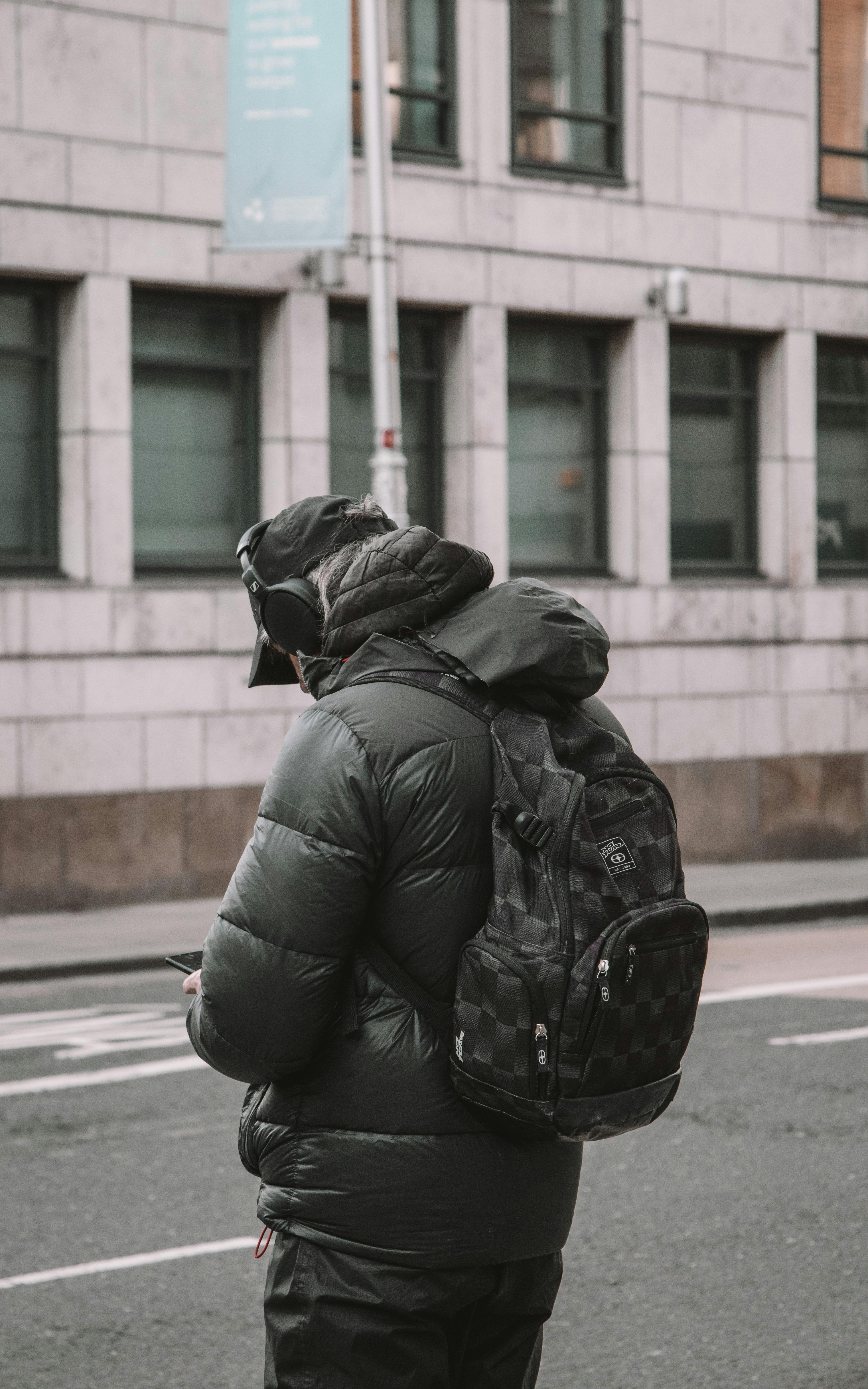 Person Wearing a Gray Puffer Jacket Standing on the Road · Free Stock Photo