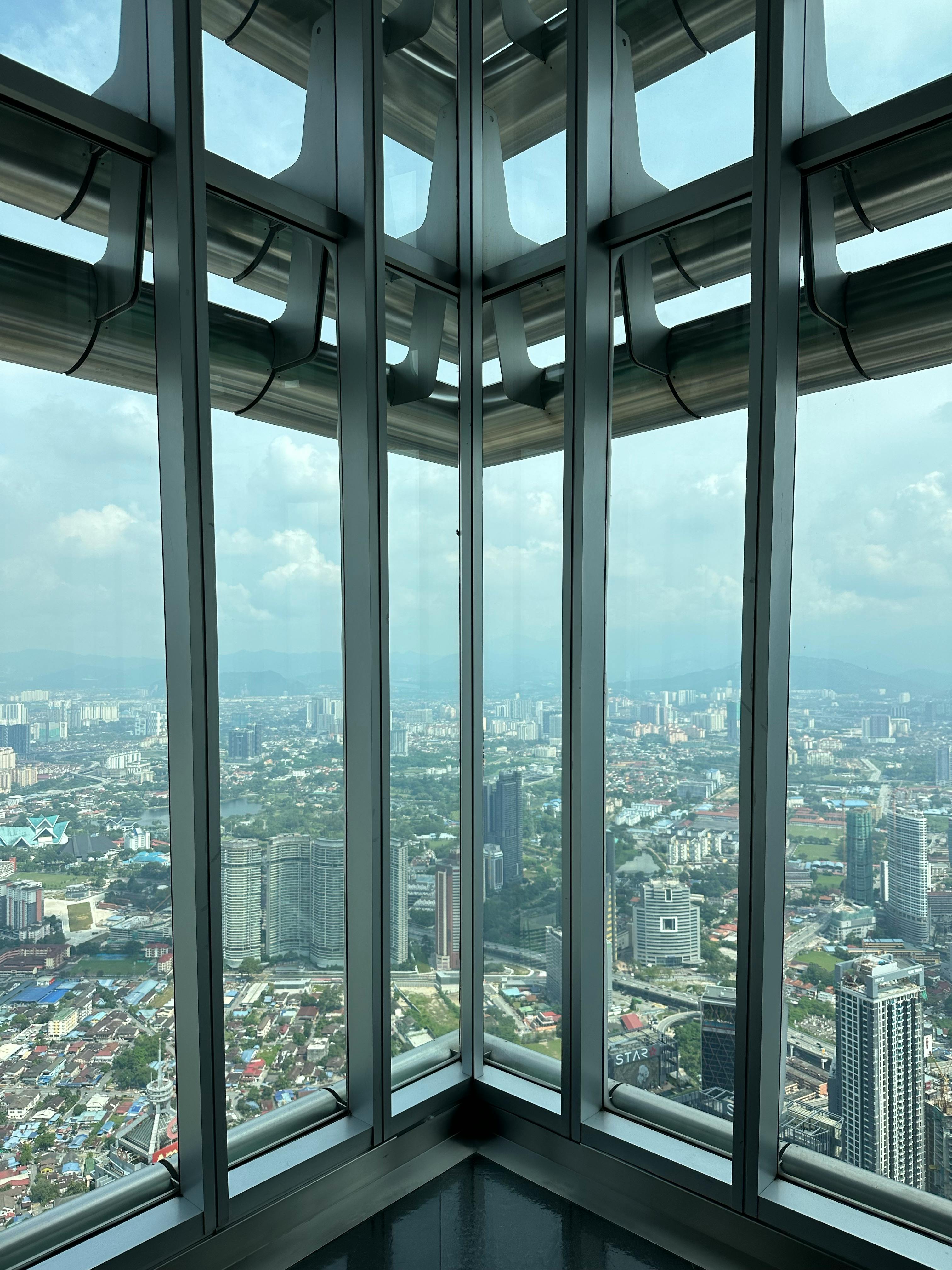 Cityscape behind Windows · Free Stock Photo