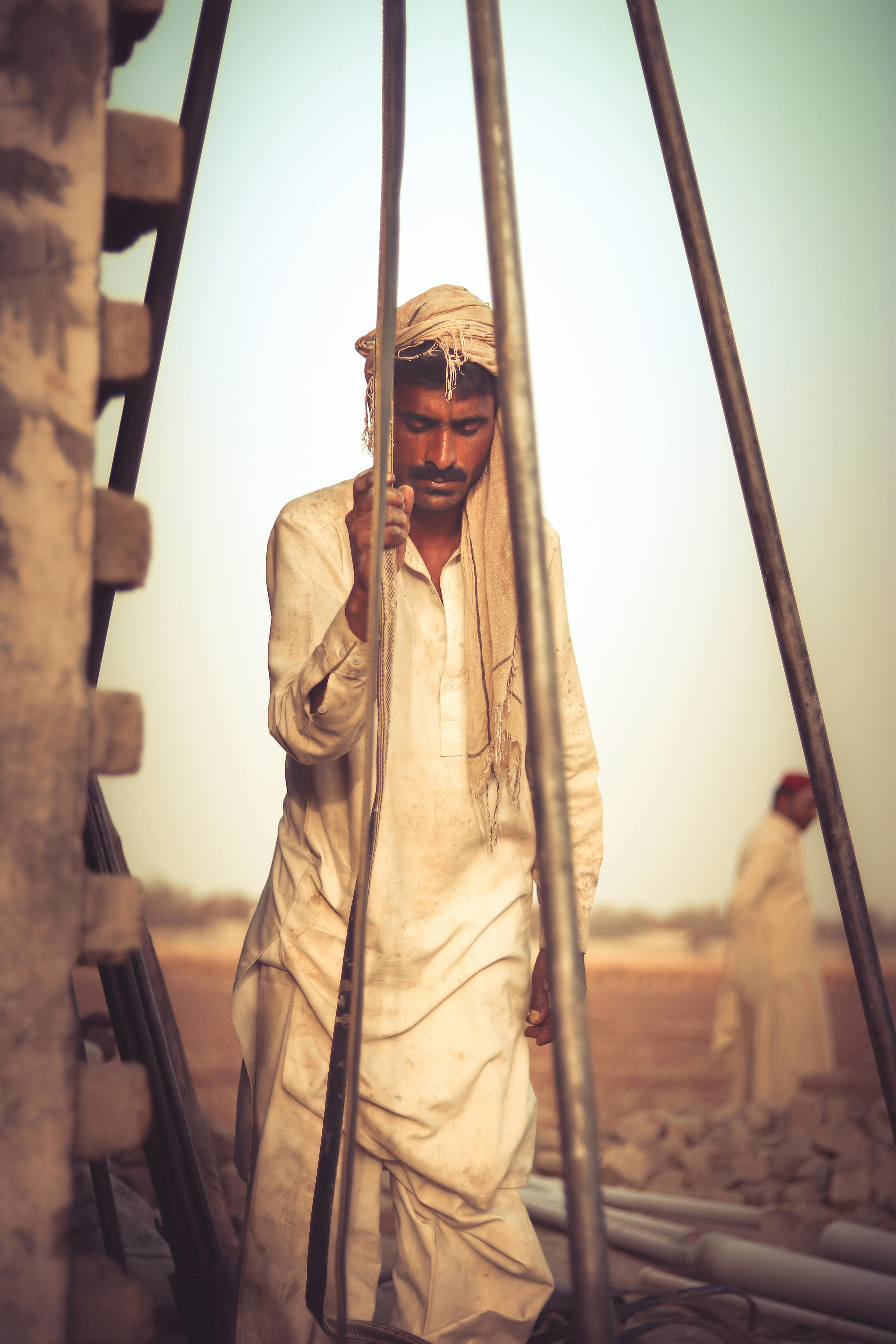 Man Working with Showel on Construction Site · Free Stock Photo