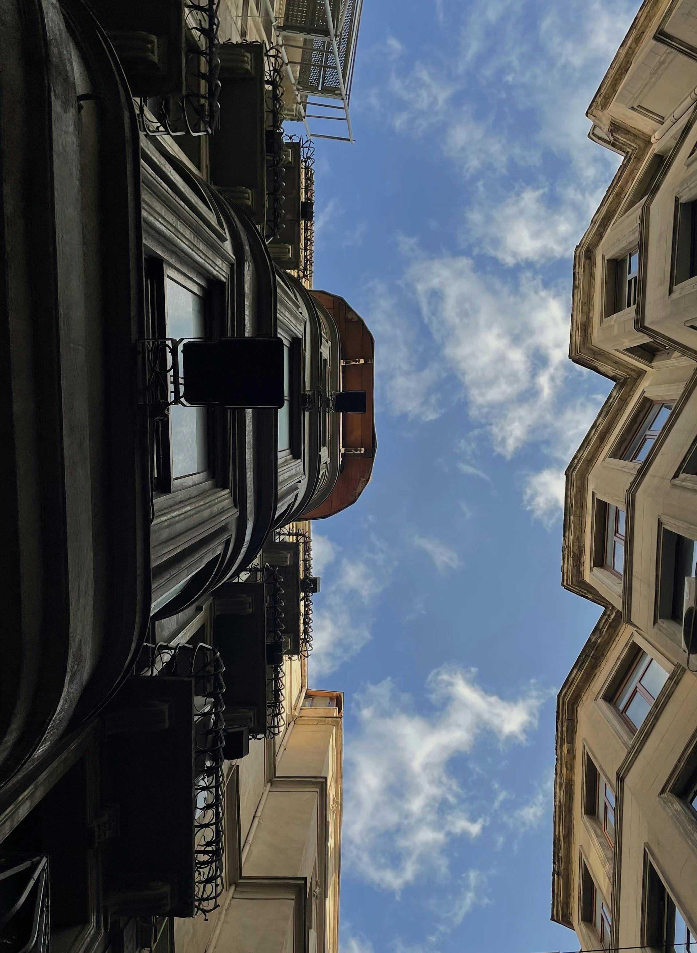Blue Sky over Buildings Walls · Free Stock Photo