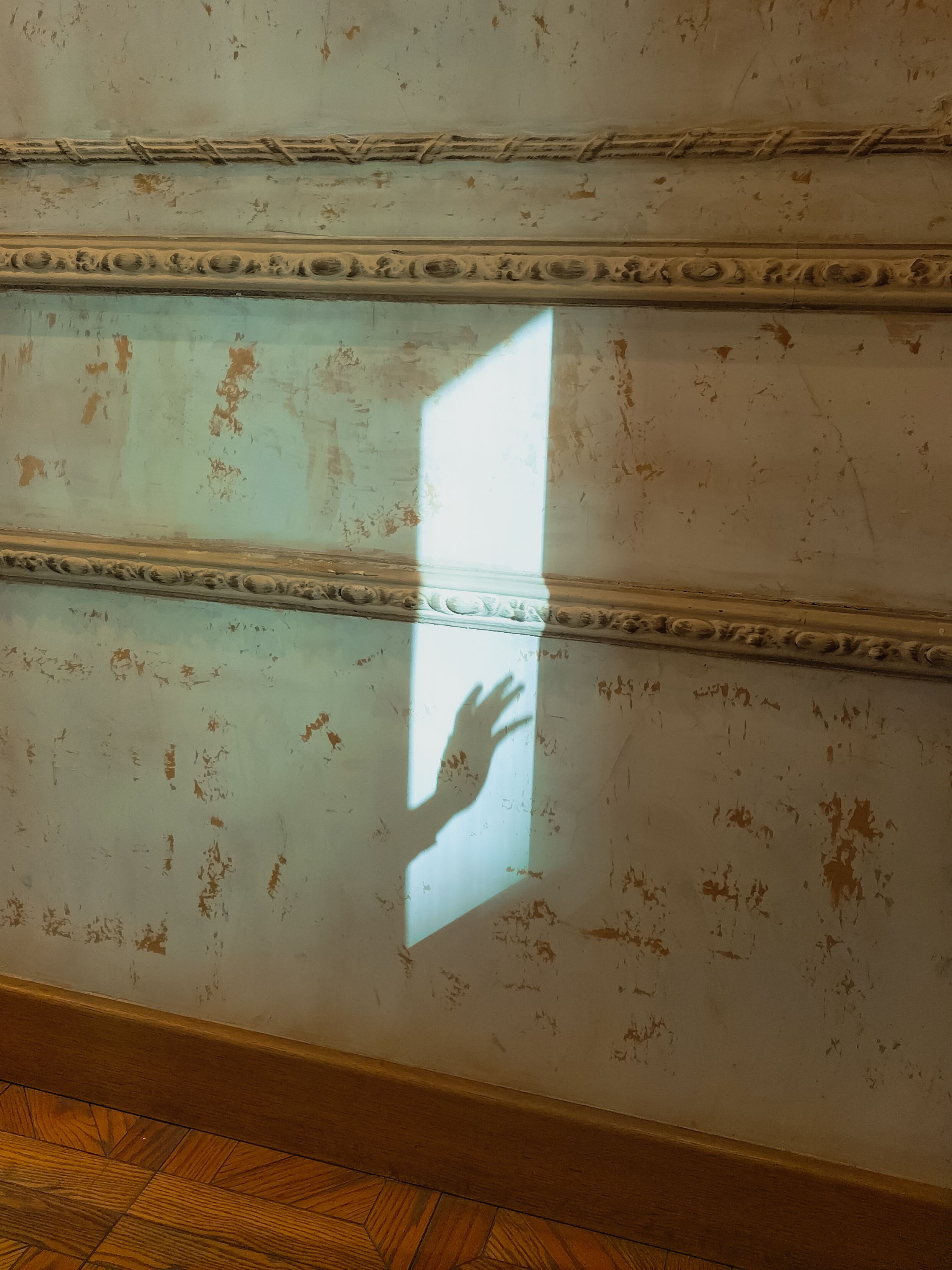 Hand Shadow on Sunlit Rectangle on Wall · Free Stock Photo