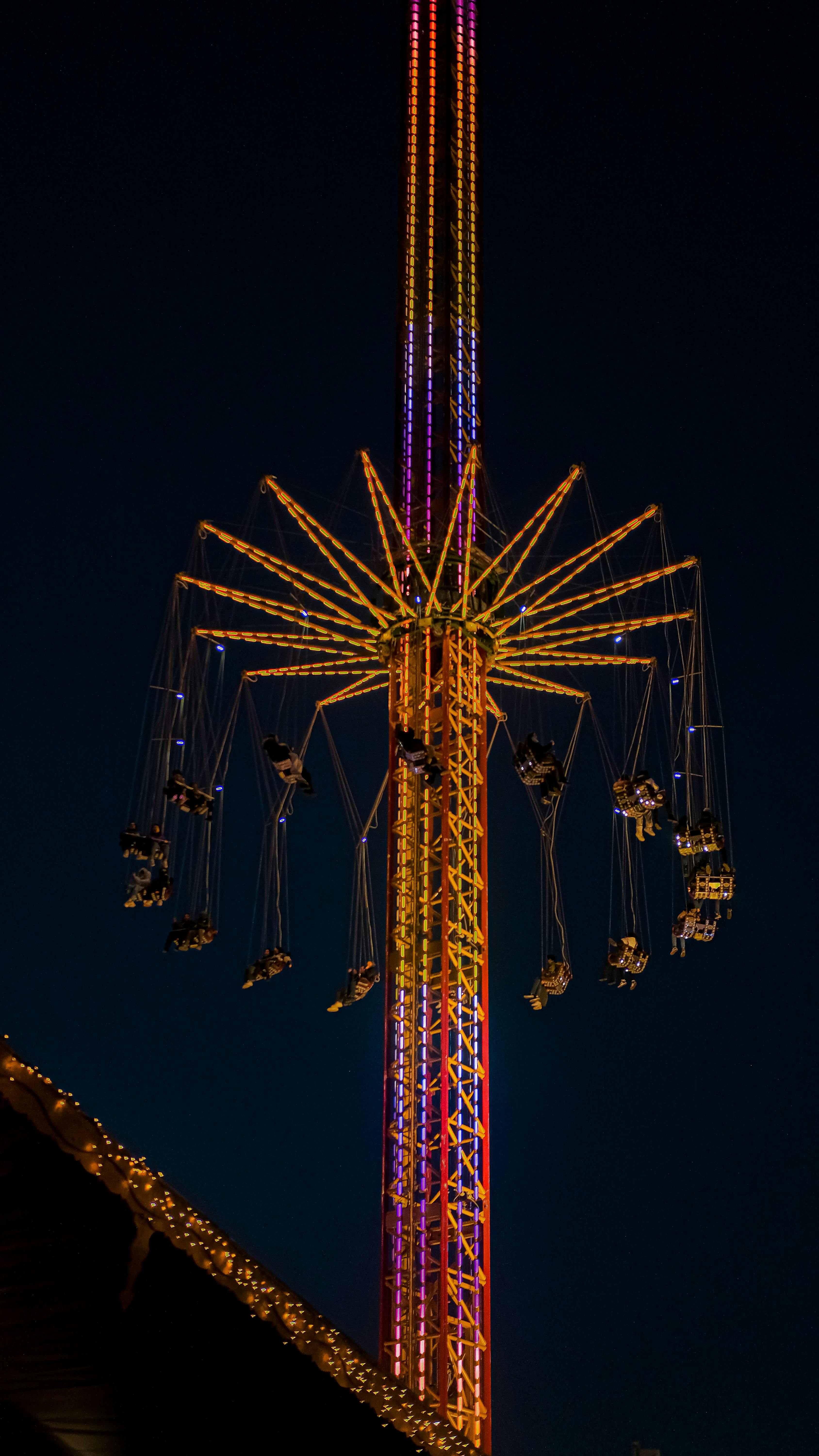 Illuminated Drop Tower in Amusement Park at Night · Free Stock Photo