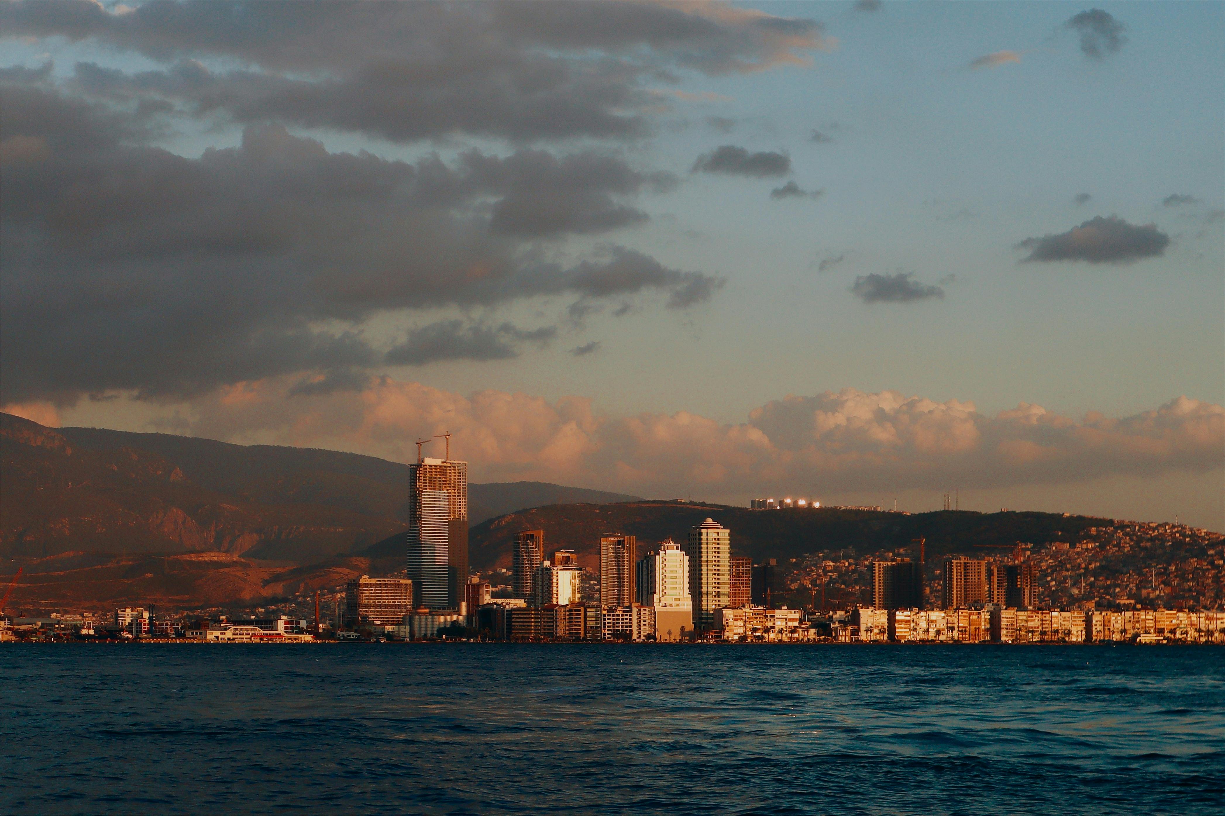 Clouds over City on Sea Shore · Free Stock Photo