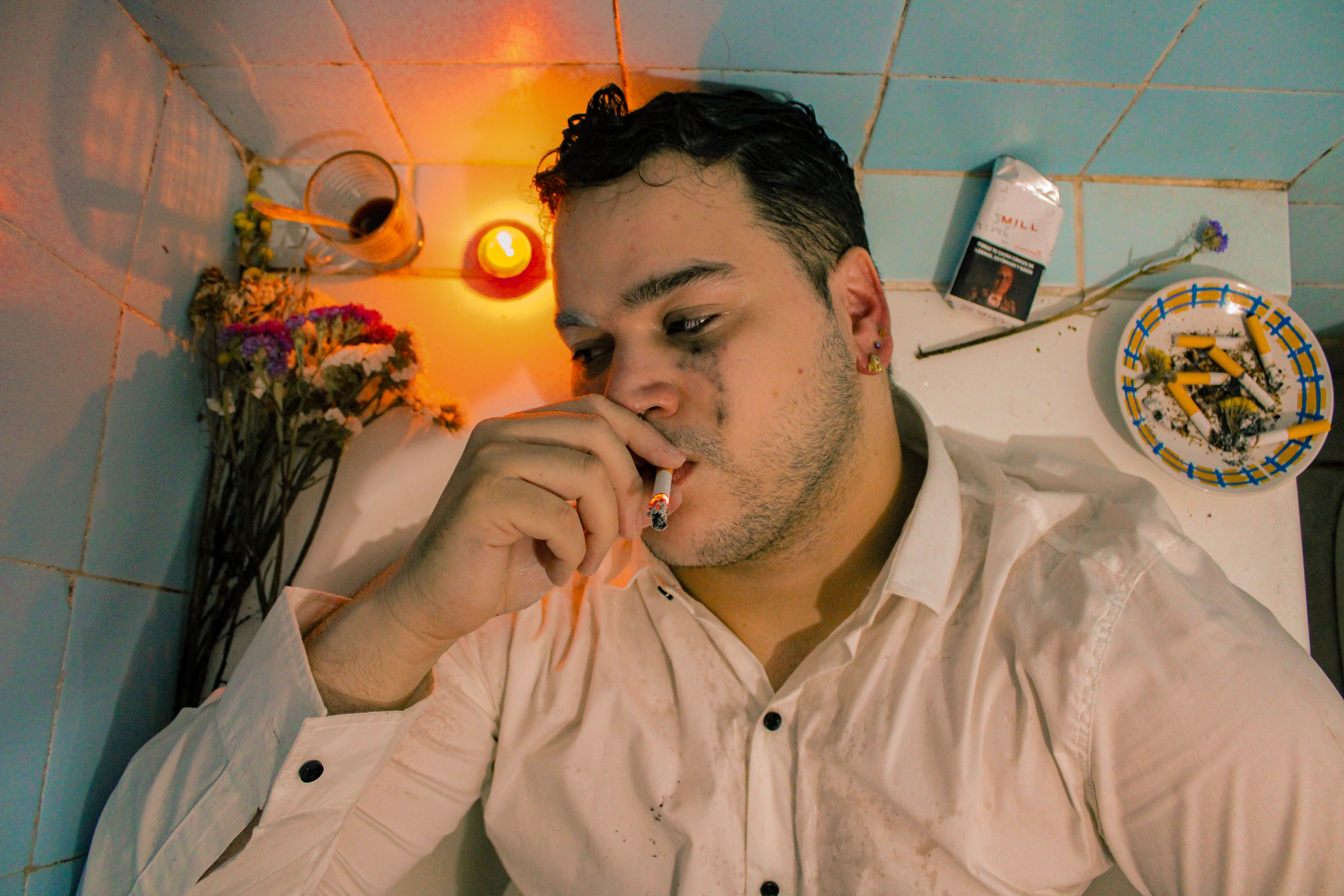 Pathetic Man Smoking in Bathtub · Free Stock Photo