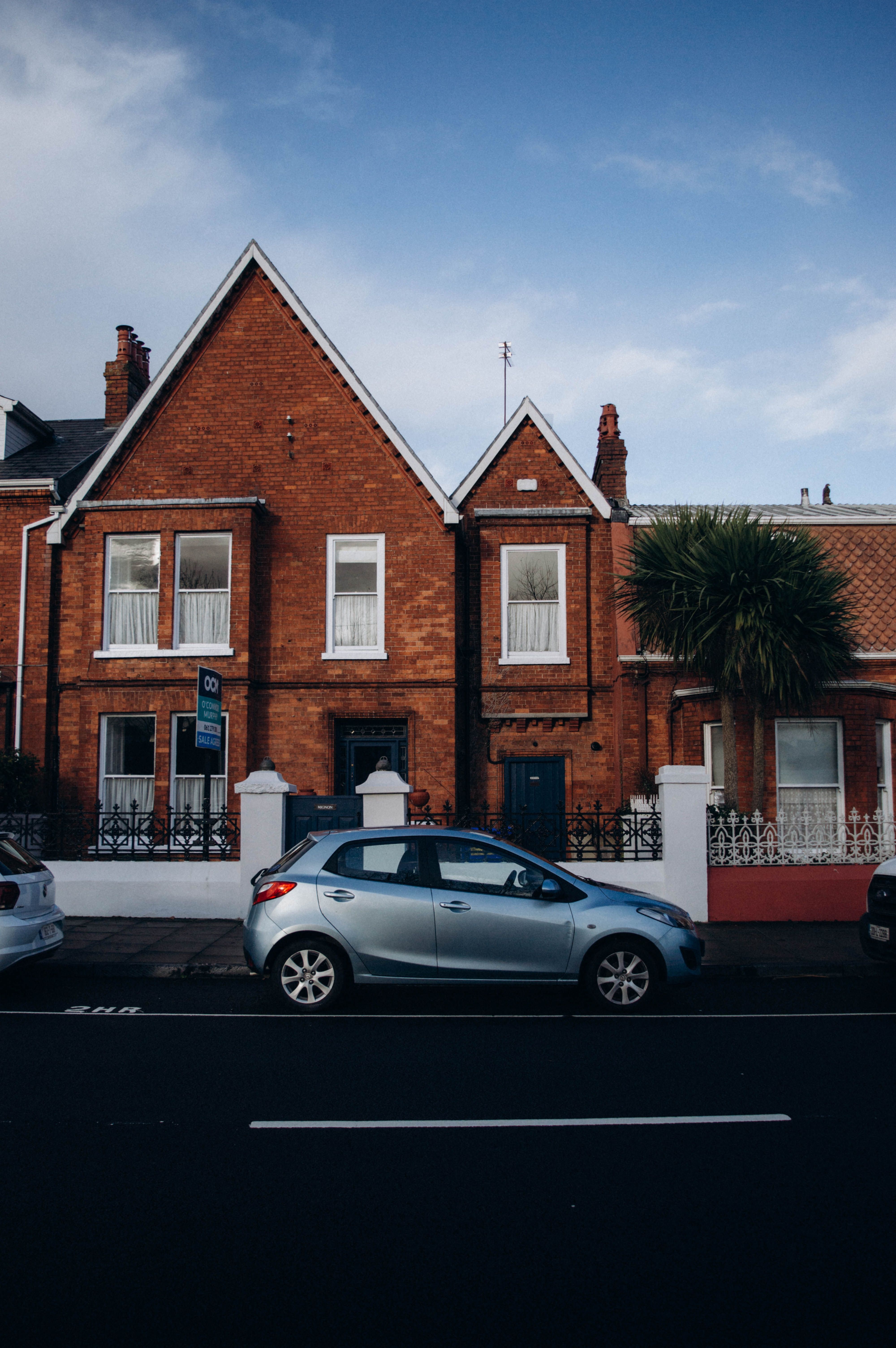Car on Parking Lot near House in Countryside · Free Stock Photo