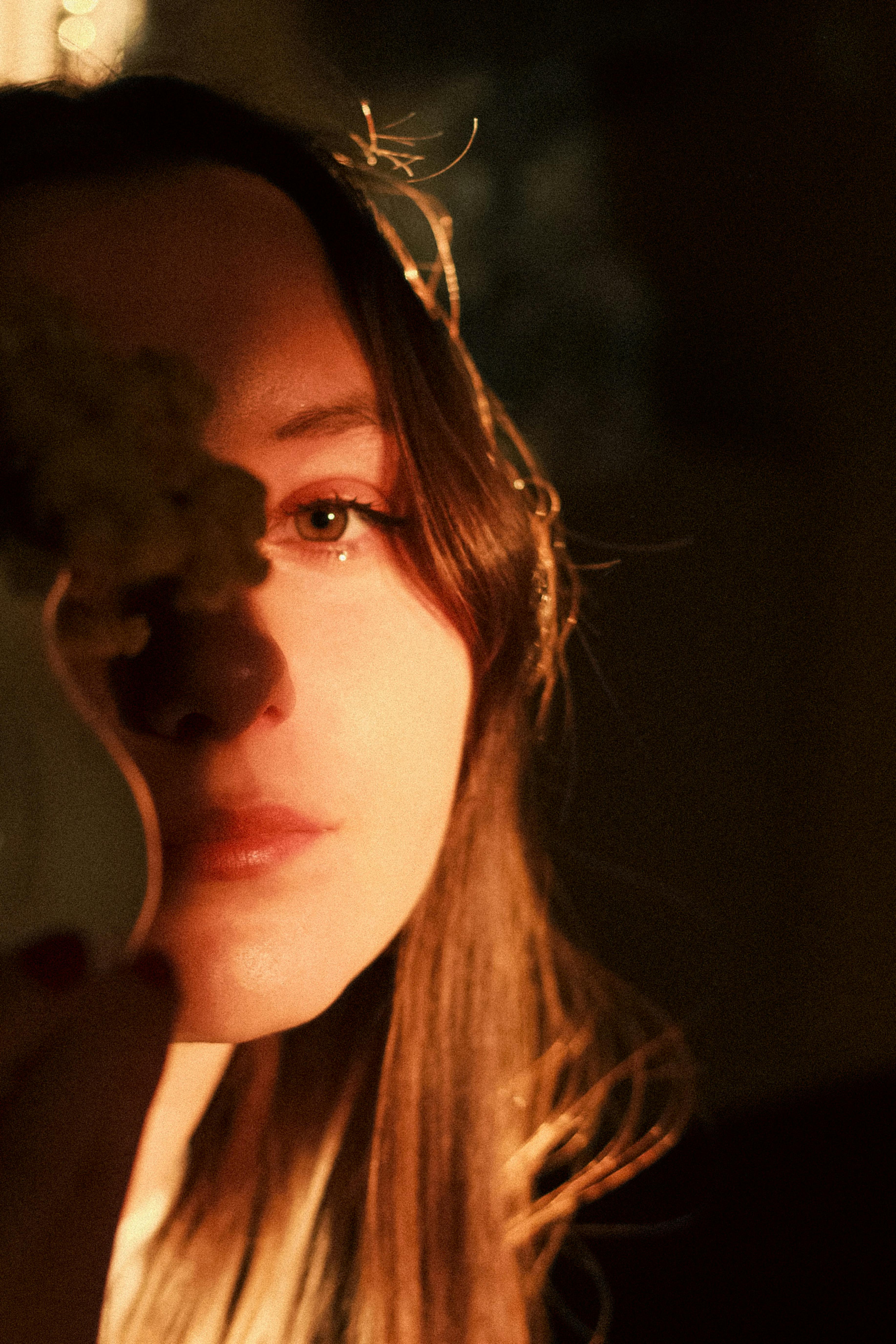 Woman with her Face Obscured by Shadow · Free Stock Photo