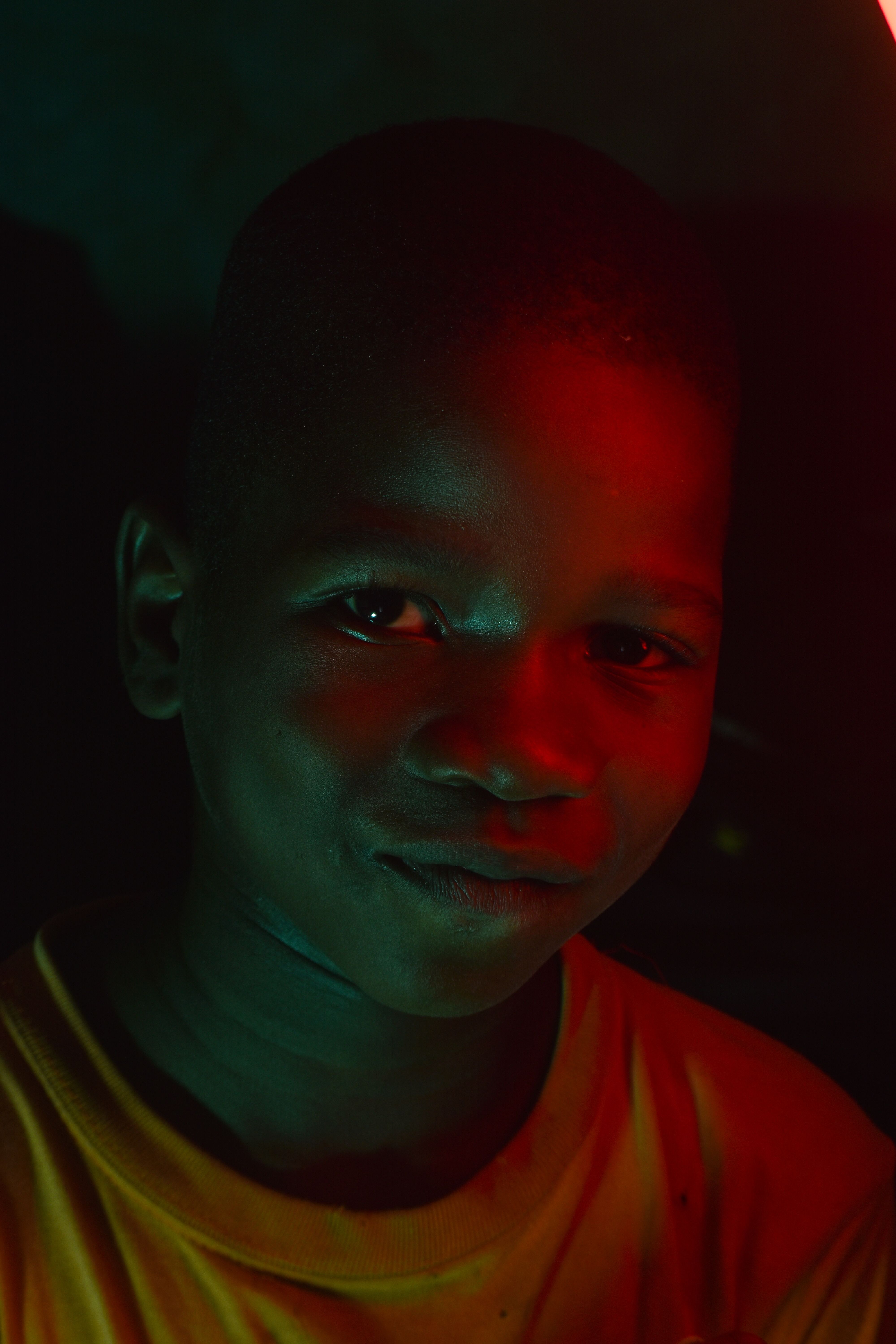 Portrait of a Boy in Dark Split Lighting · Free Stock Photo