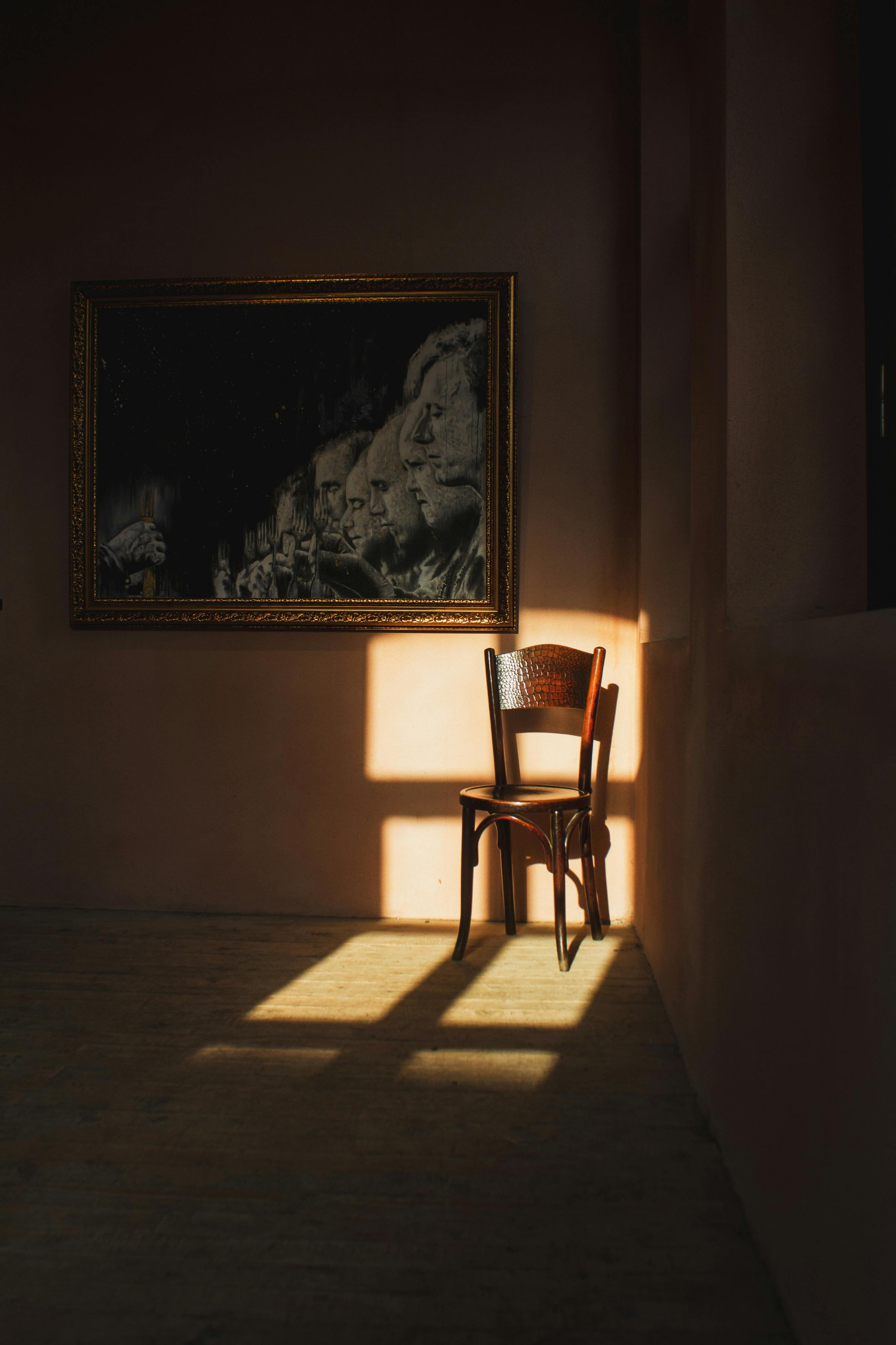 Empty Chair in Light in Room in Shadow · Free Stock Photo