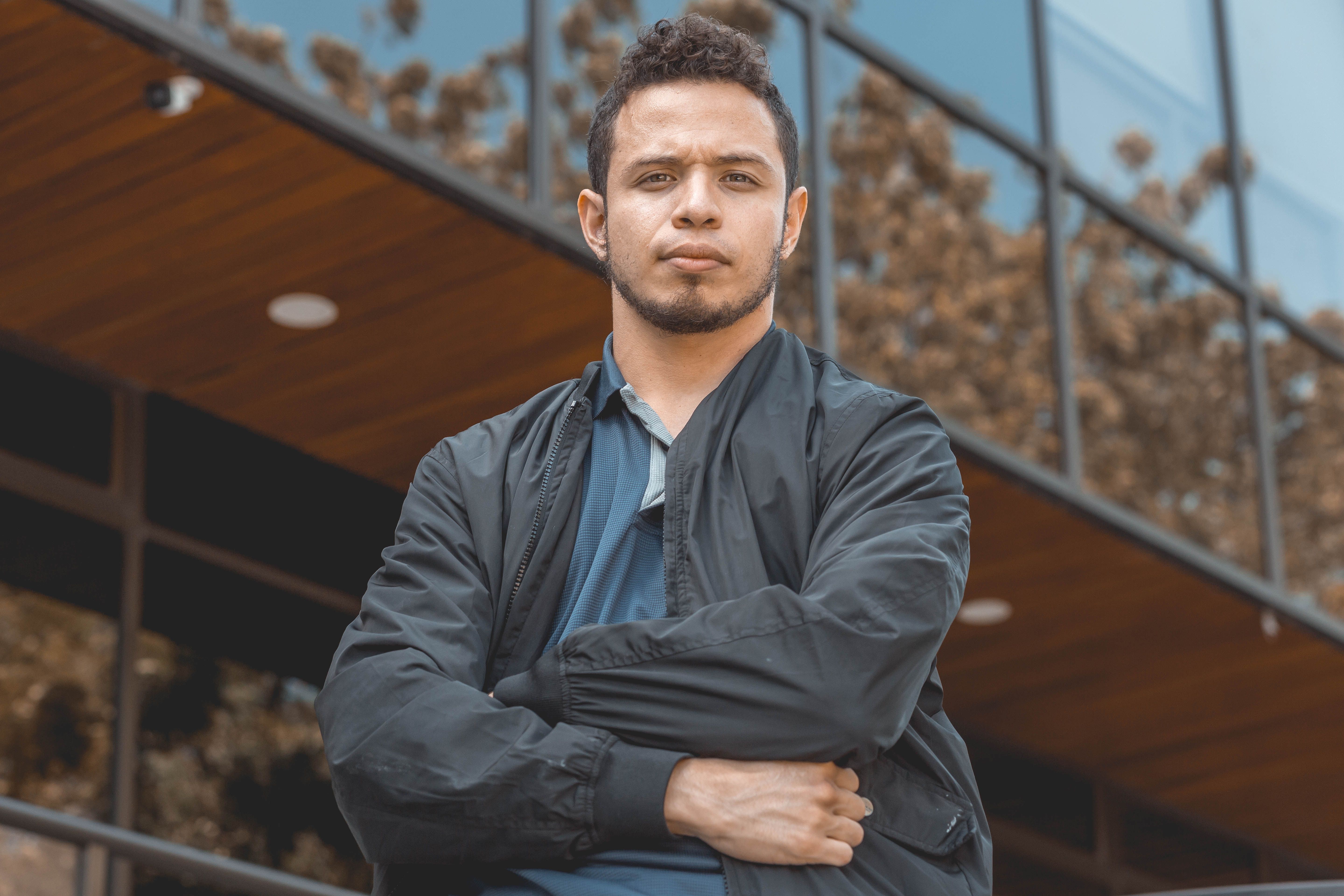 Man in Black Suit Jacket with His Arms Crossed · Free Stock Photo