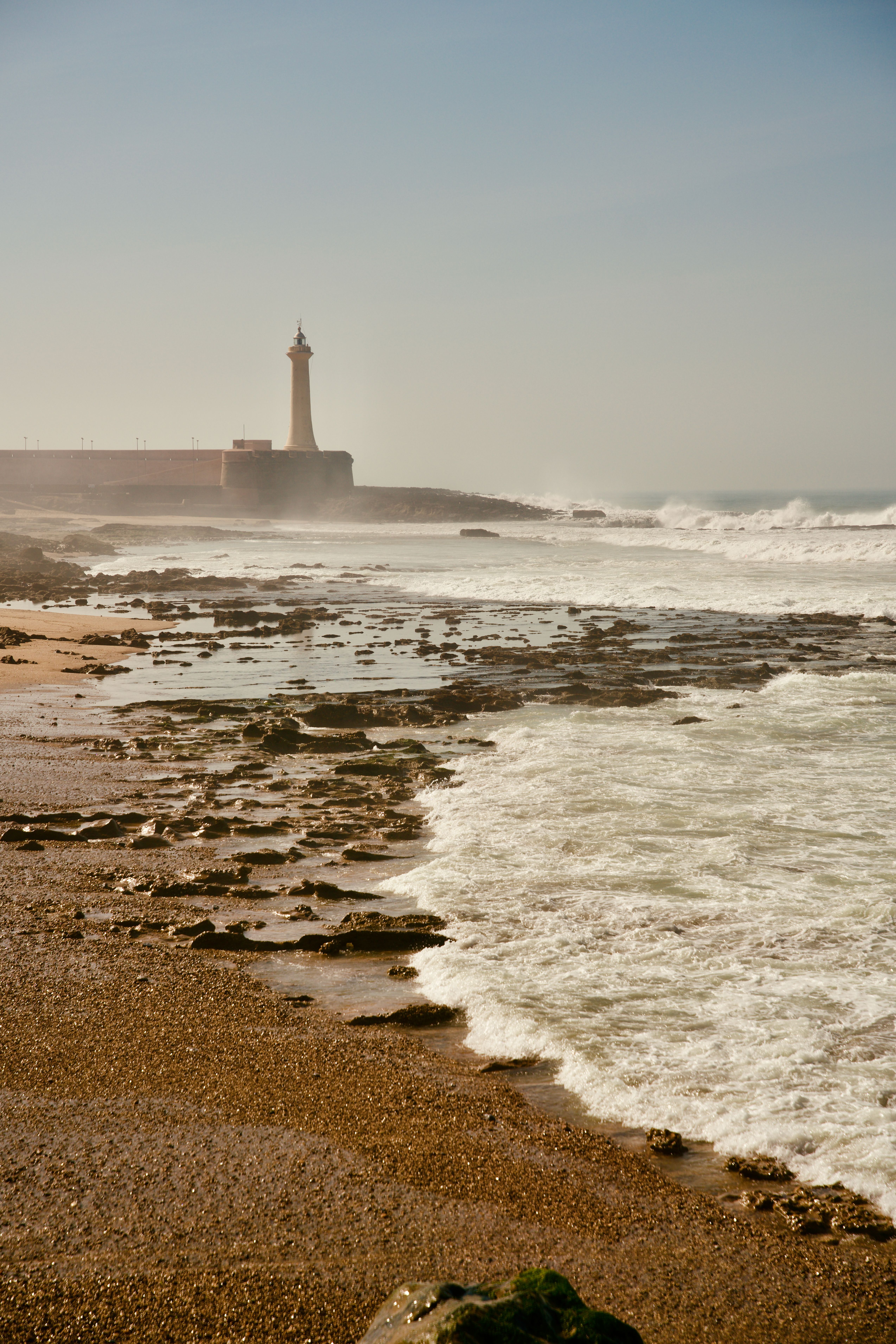 Panorama of a Beach with a Lighthouse in the Distance, Rabat, Morocco ...