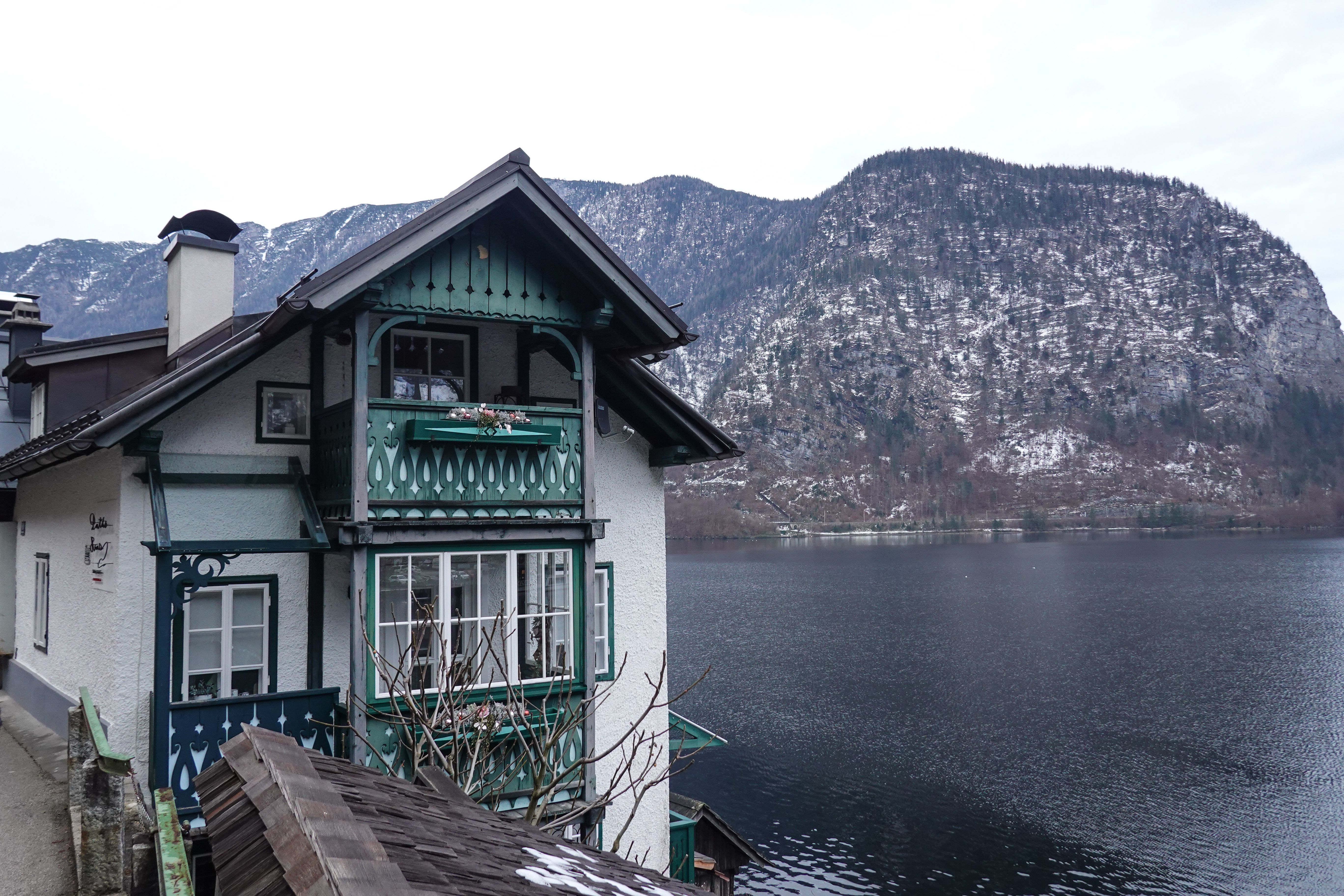 Traditional Residential House by the Lake with Mountains in the ...