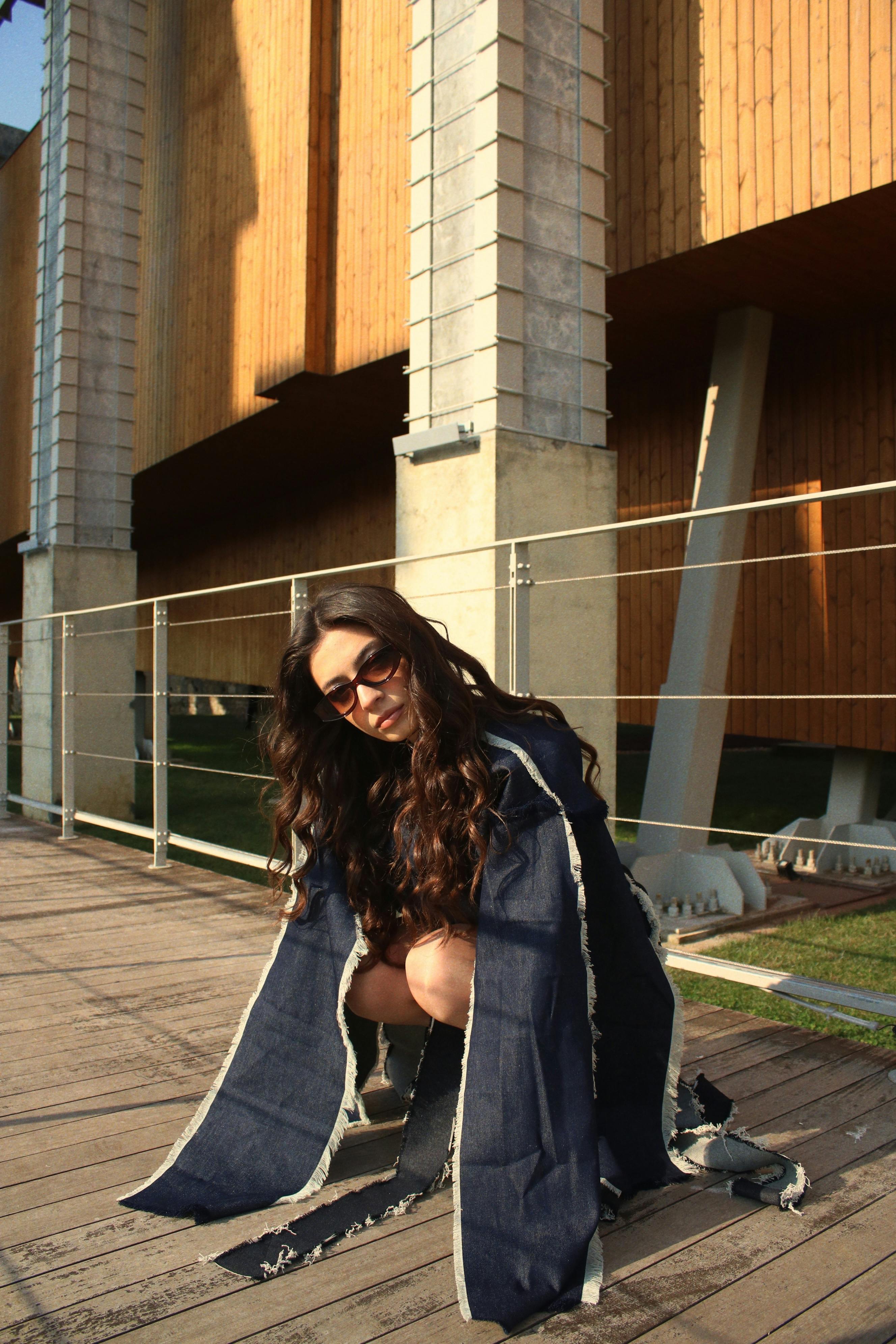 Woman Crouching and Posing · Free Stock Photo