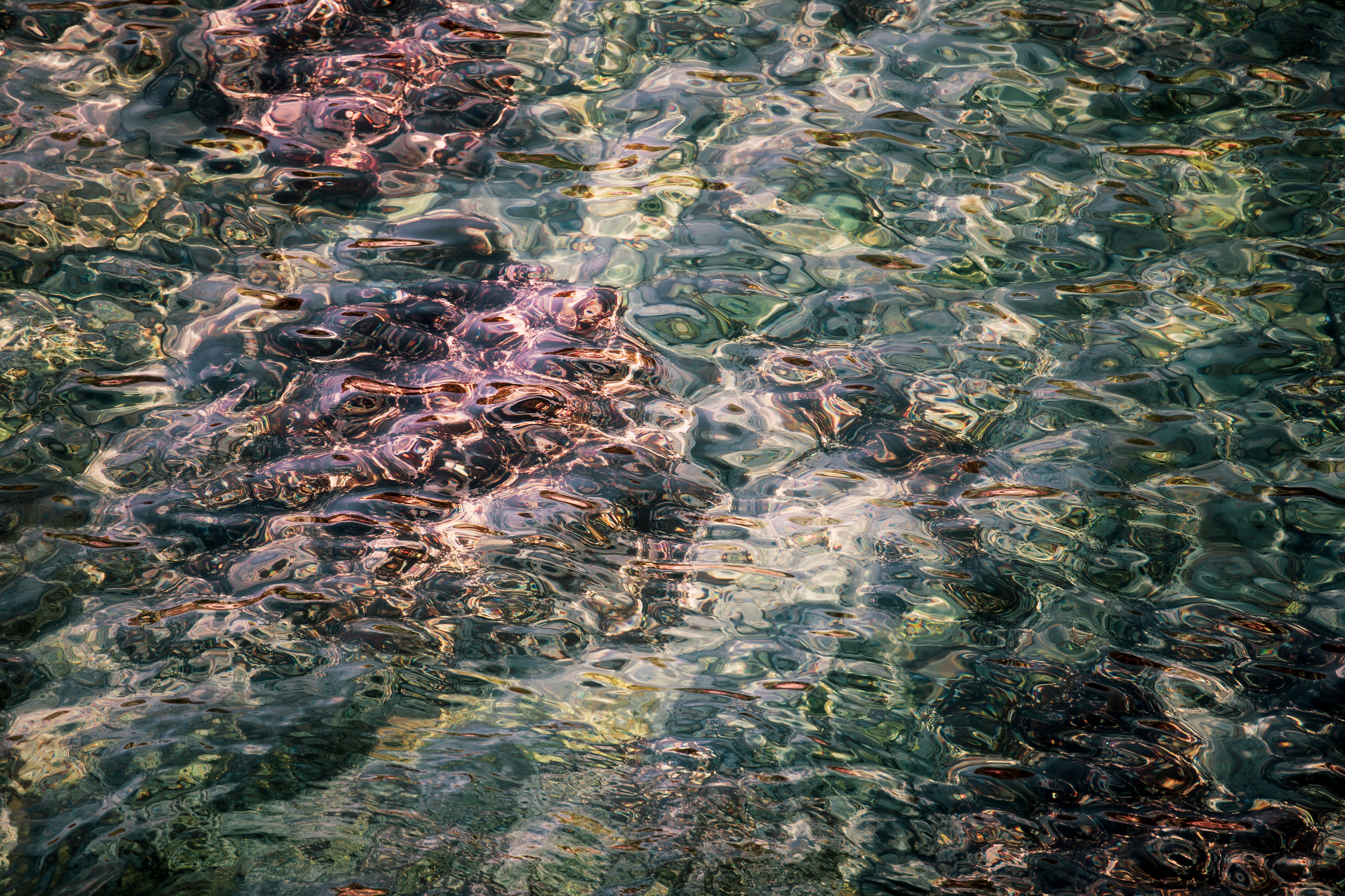 Iridescent Surface of Stream Water · Free Stock Photo